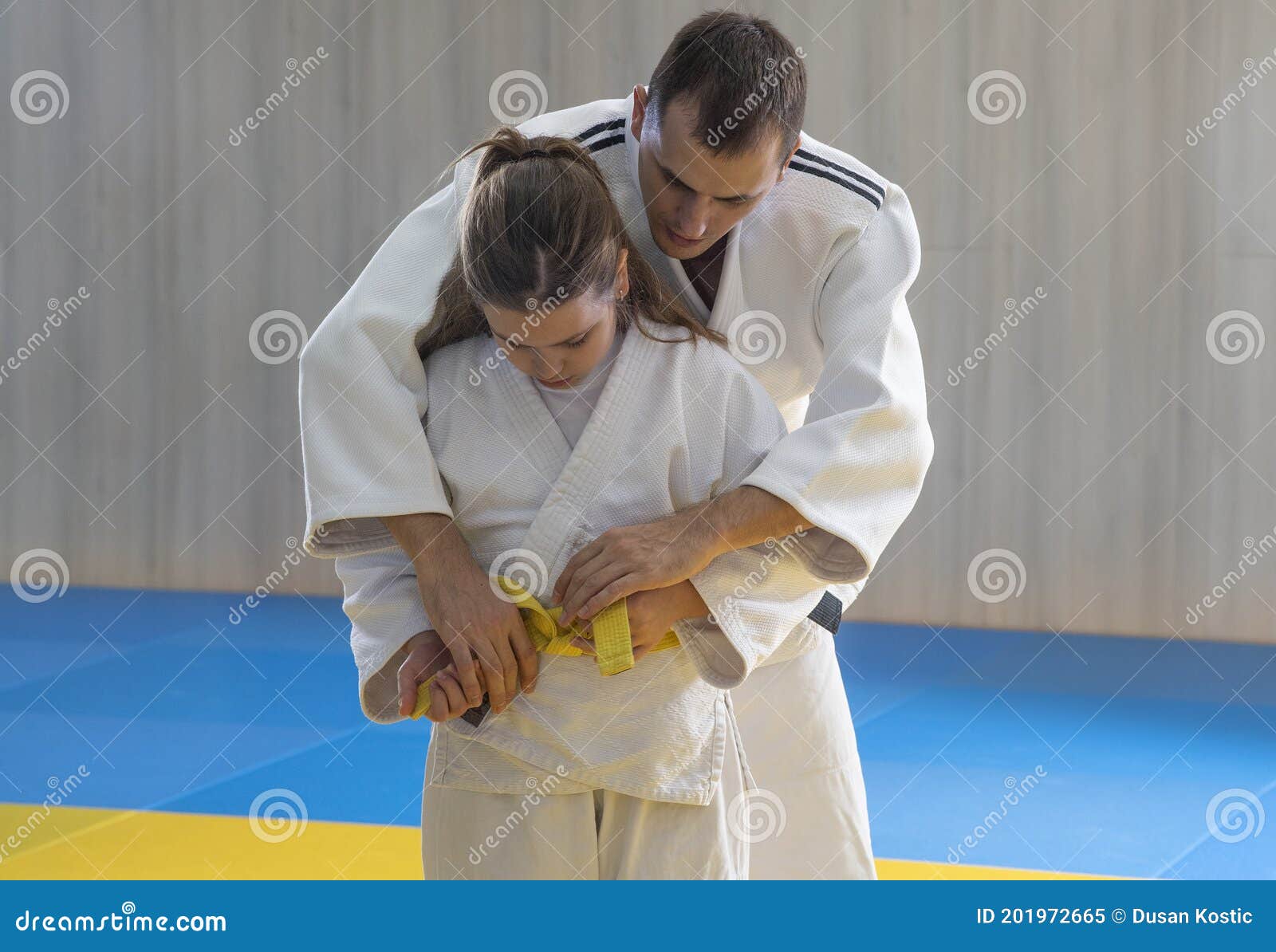 Judo Trainer Tying Belt for His Pupil before Competition Stock Image ...