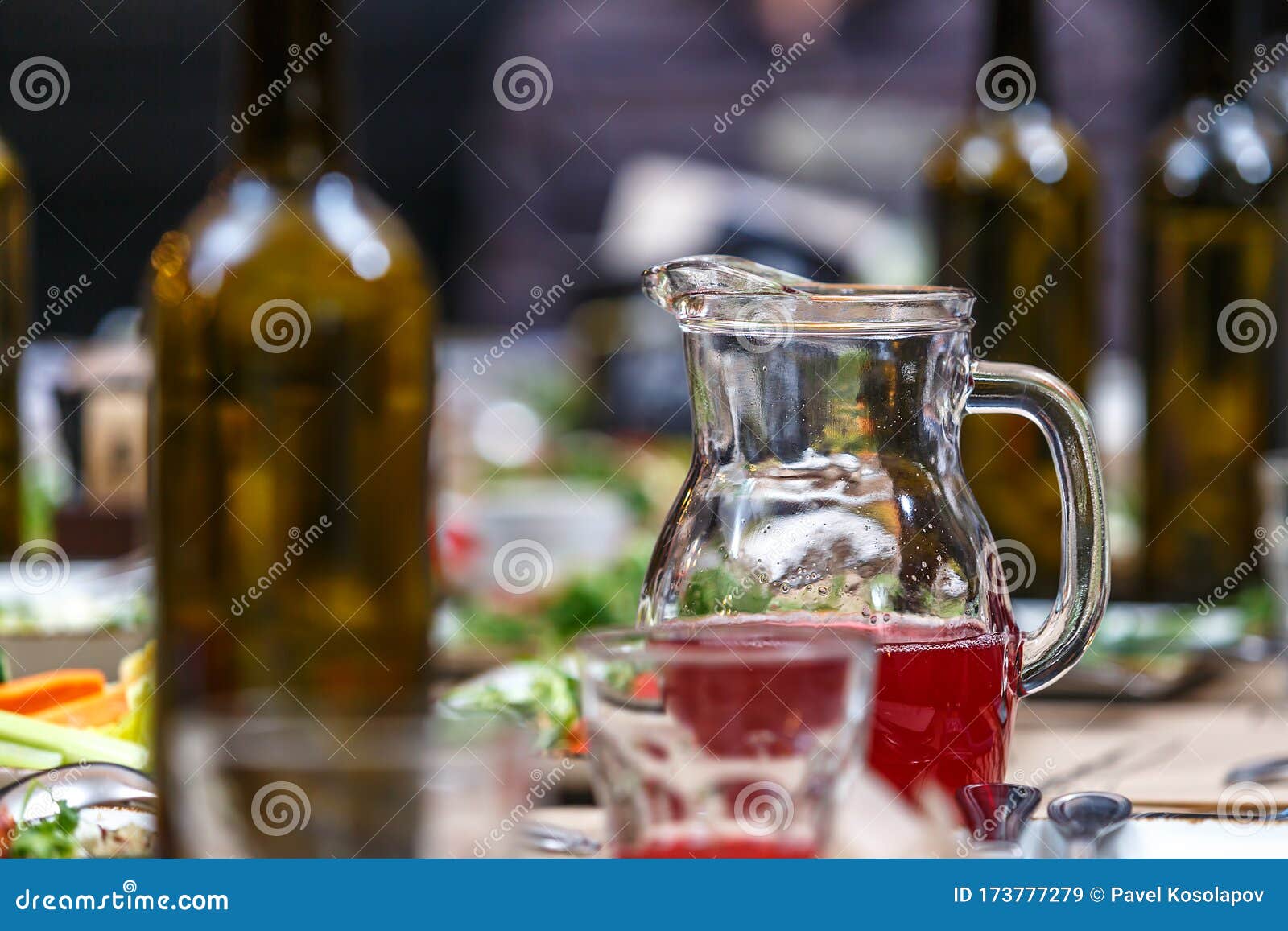 A Jug of Fruit Juice on the Table Stock Image - Image of leaf, dishes ...