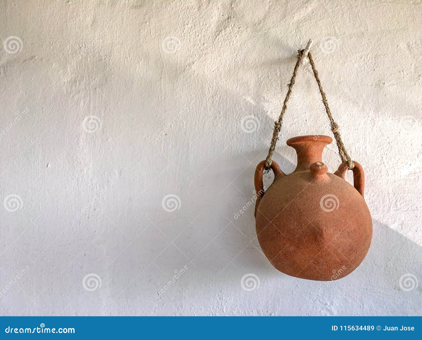 Jug hanging from a rope stock image. Image of typical - 115634489