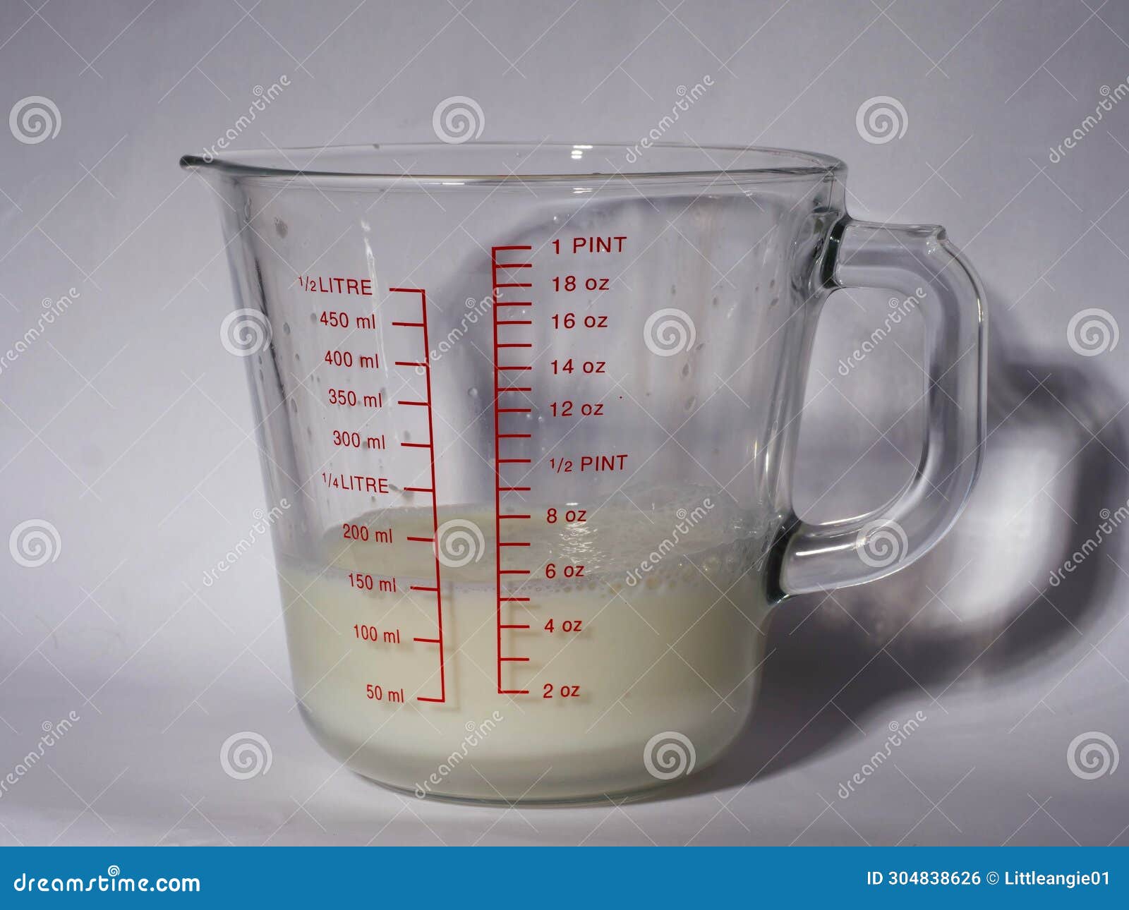 Jug of Milk in Glass Measuring Jug White Background Stock Photo - Image ...