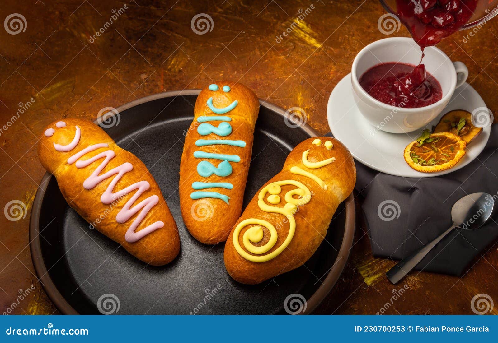 Jug Serving Purple Colada in a White Cup Next To Three Guaguas De Pan ...