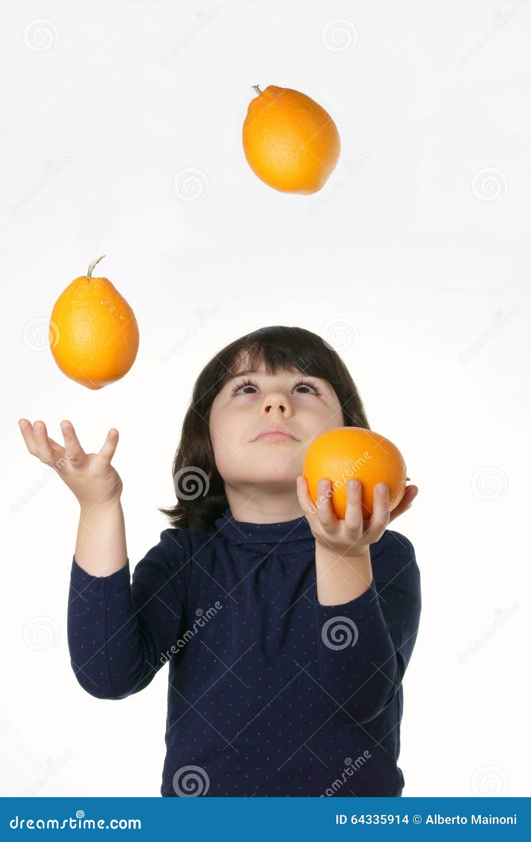 Juggler child with oranges stock photo. Image of blue - 64335914