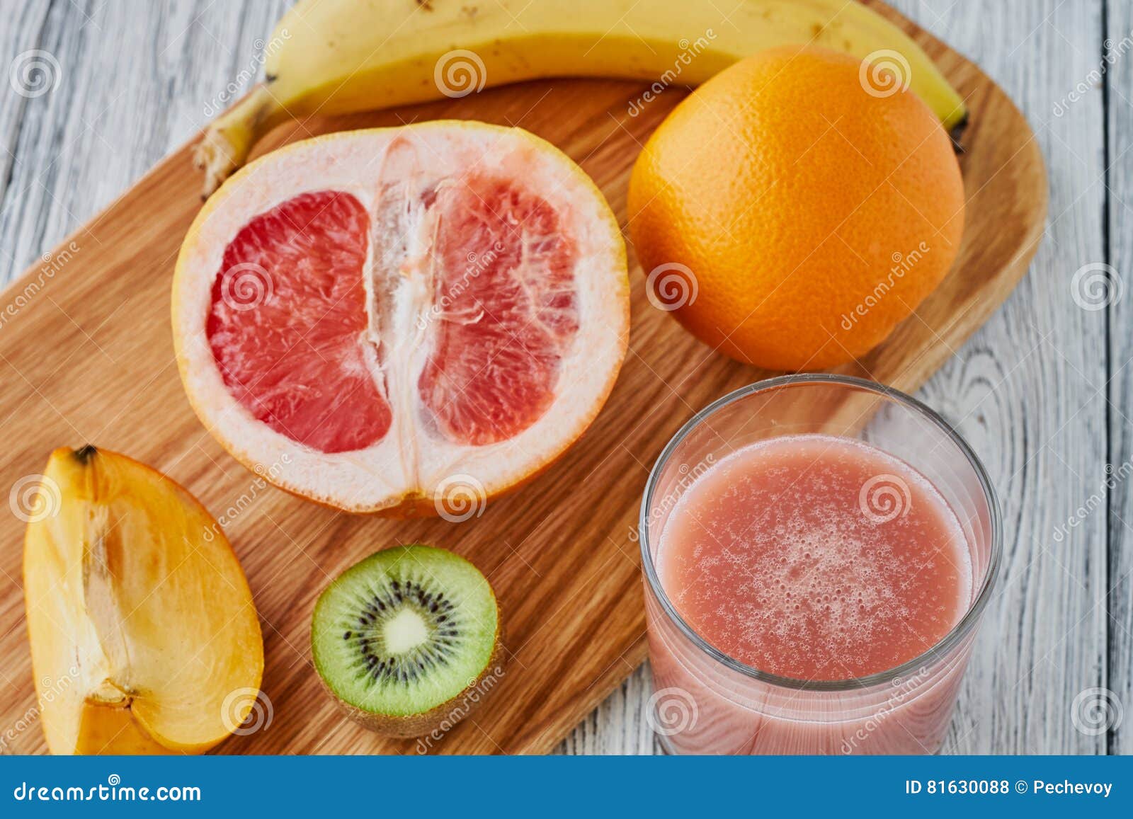 Juice of a Grapefruit, Kiwi and Orange Stock Photo - Image of eating ...