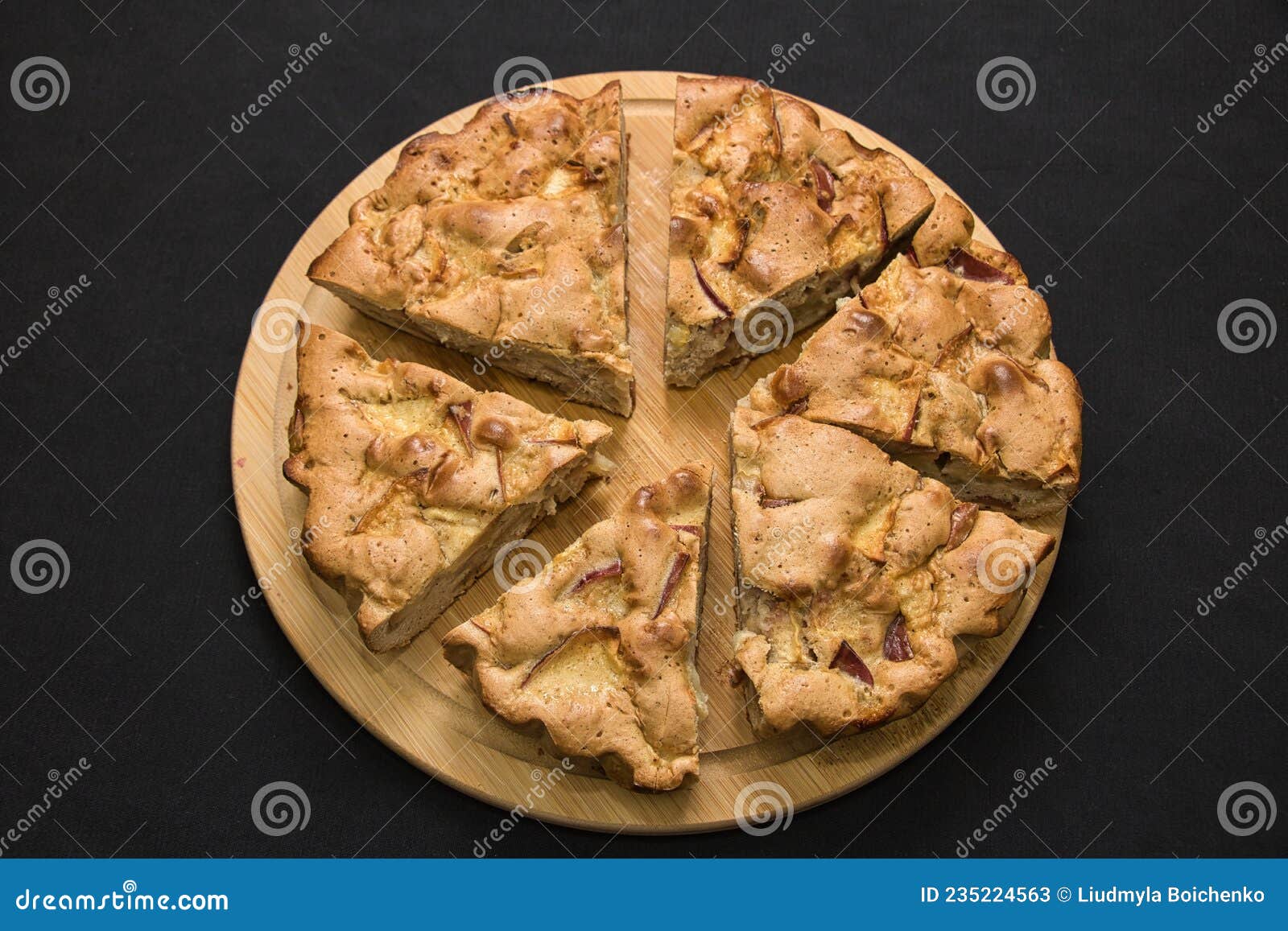 Juicy Apple Pie Cut into Pieces on a Dark Background Close Up Stock ...