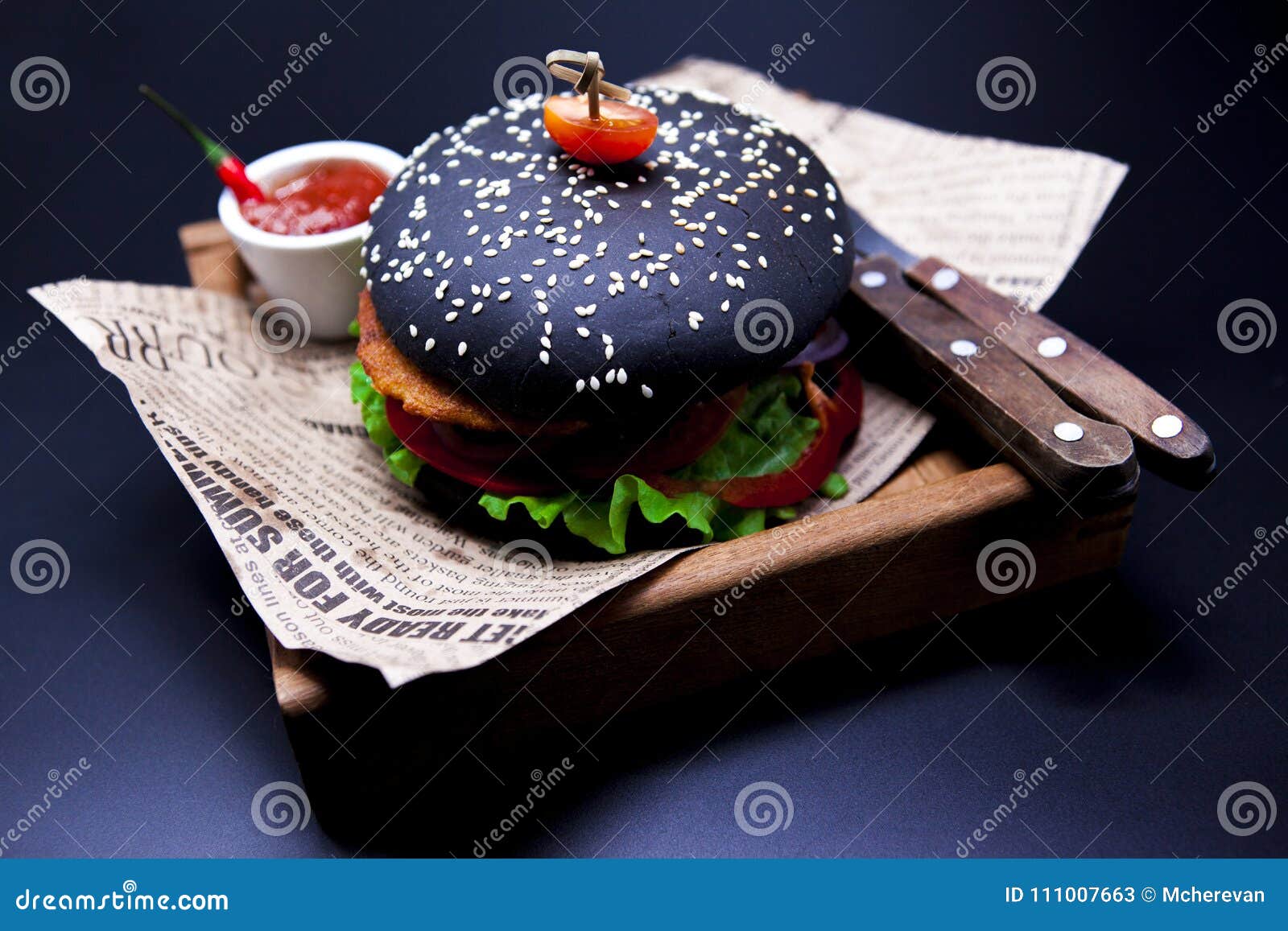 A Juicy Black Burger. Burger with Marble Beef, Fork with Knife and ...