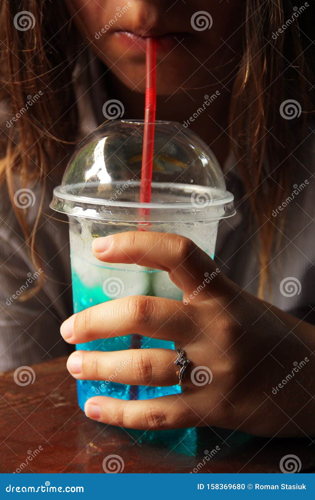 Juicy Drink in the Hand. Girl Drinks a Cocktail Stock Photo - Image of ...