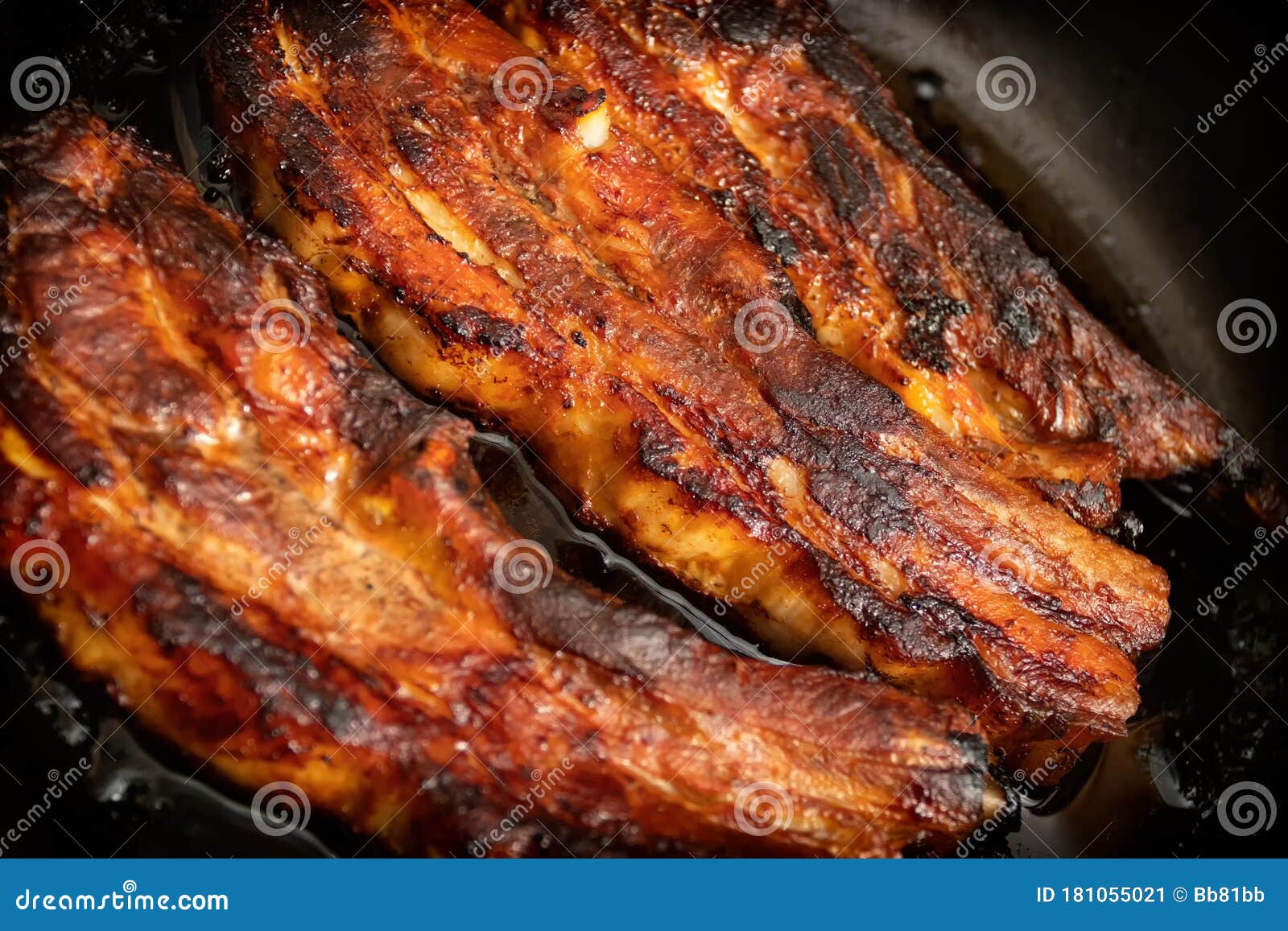 Juicy Fried Pork Ribs in a Cast Iron Pan Stock Image - Image of roast ...