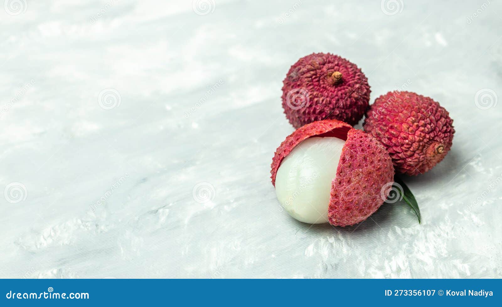 Juicy Lychee with Cut in Half and Leaves on a Light Background, Long ...