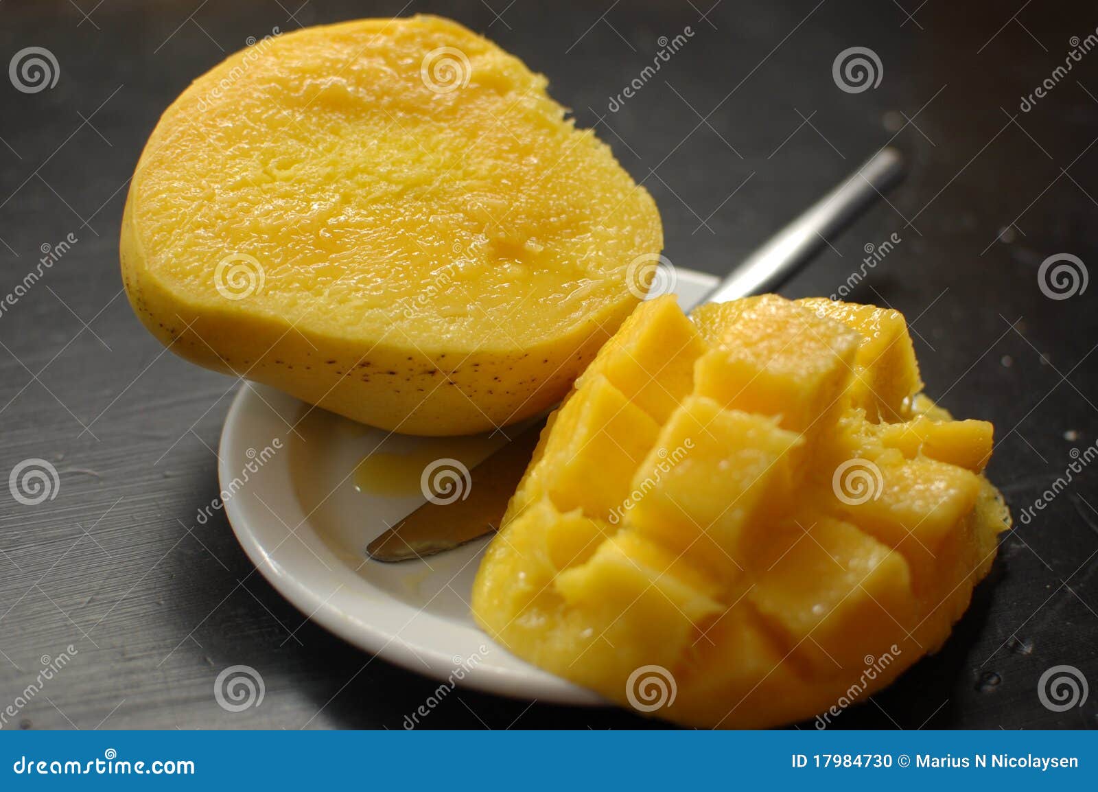 Juicy mango on plate stock photo. Image of fresh, halved - 17984730