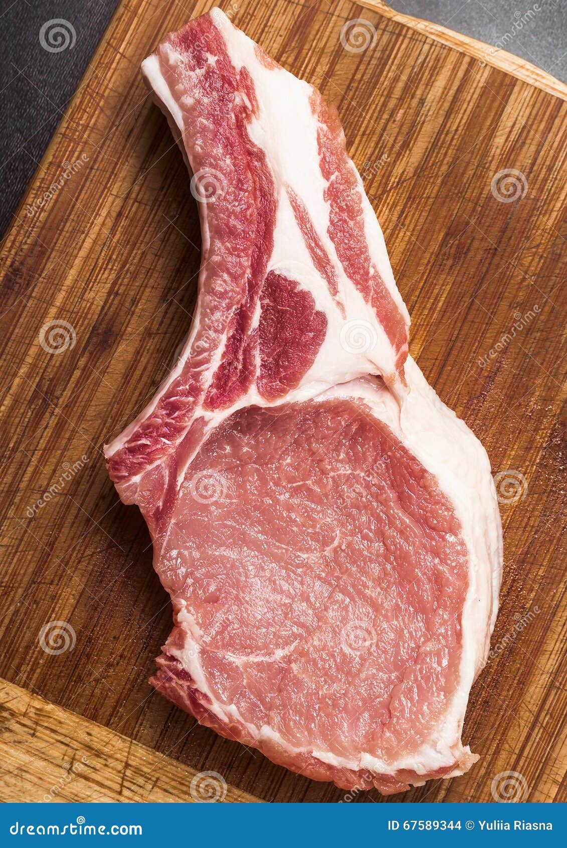 Juicy Piece of Meat on the Bone with Lie on a Wooden Table. Stock Photo ...