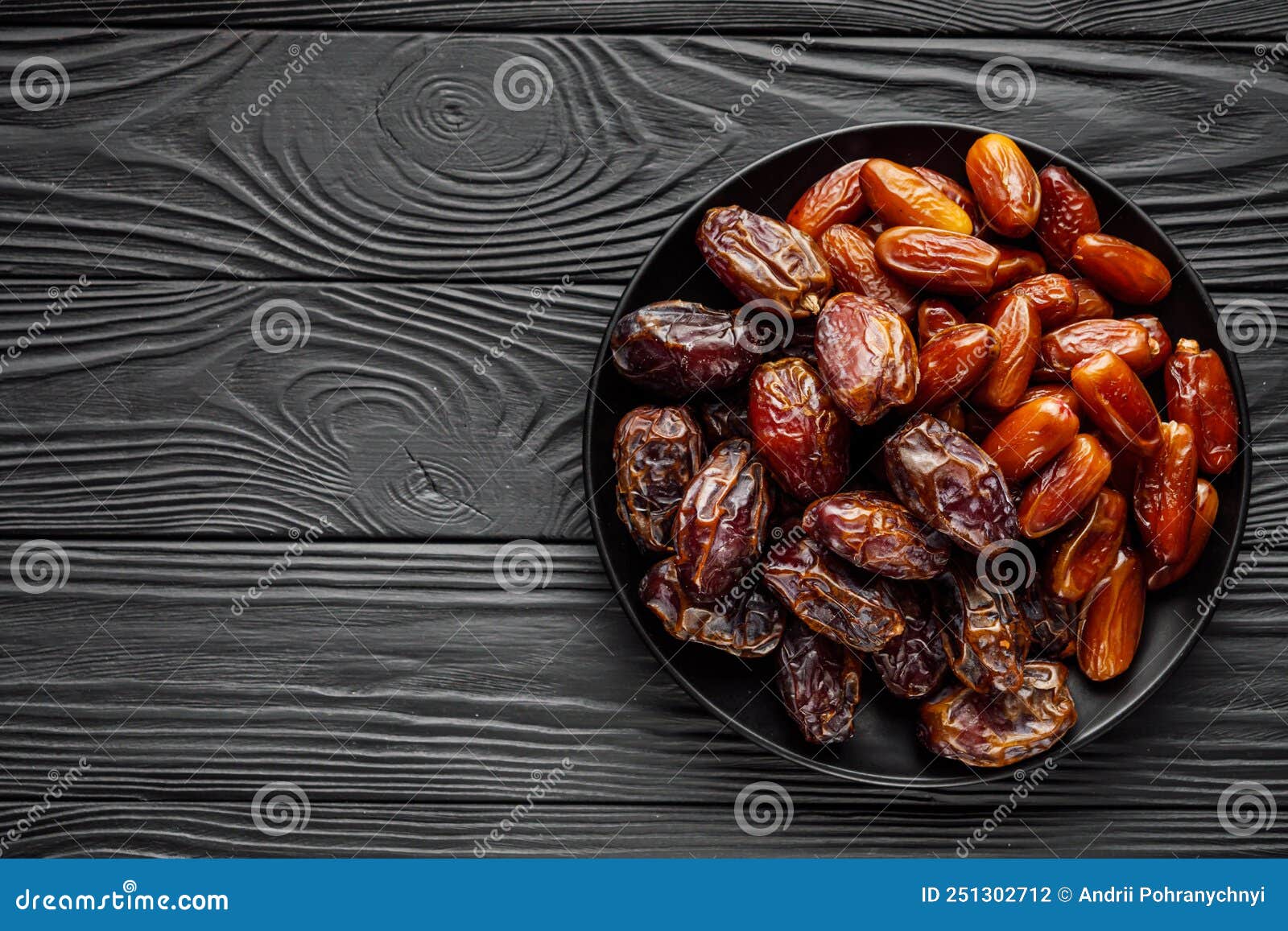 Juicy Royal Dates on a Black Wooden Rustic Background Stock Photo ...