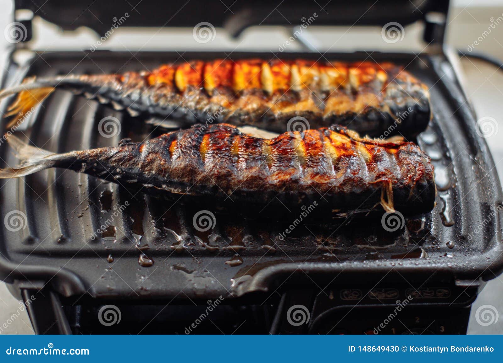 Juicy Tasty fish grilled stock photo. Image of heat - 148649430