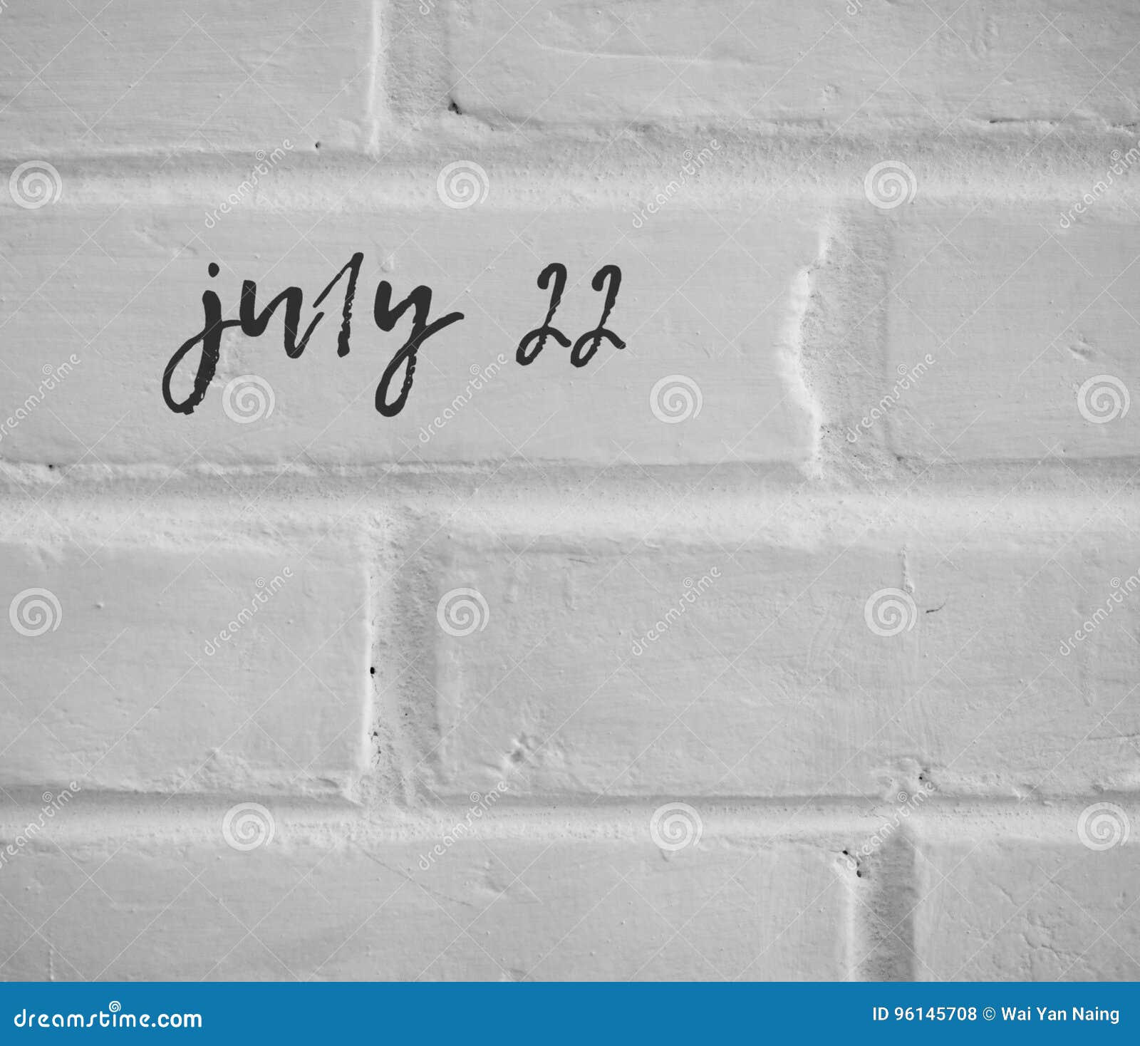 July 22 WRITTEN on WHITE PLAIN BRICK WALL Stock Photo - Image of banner ...