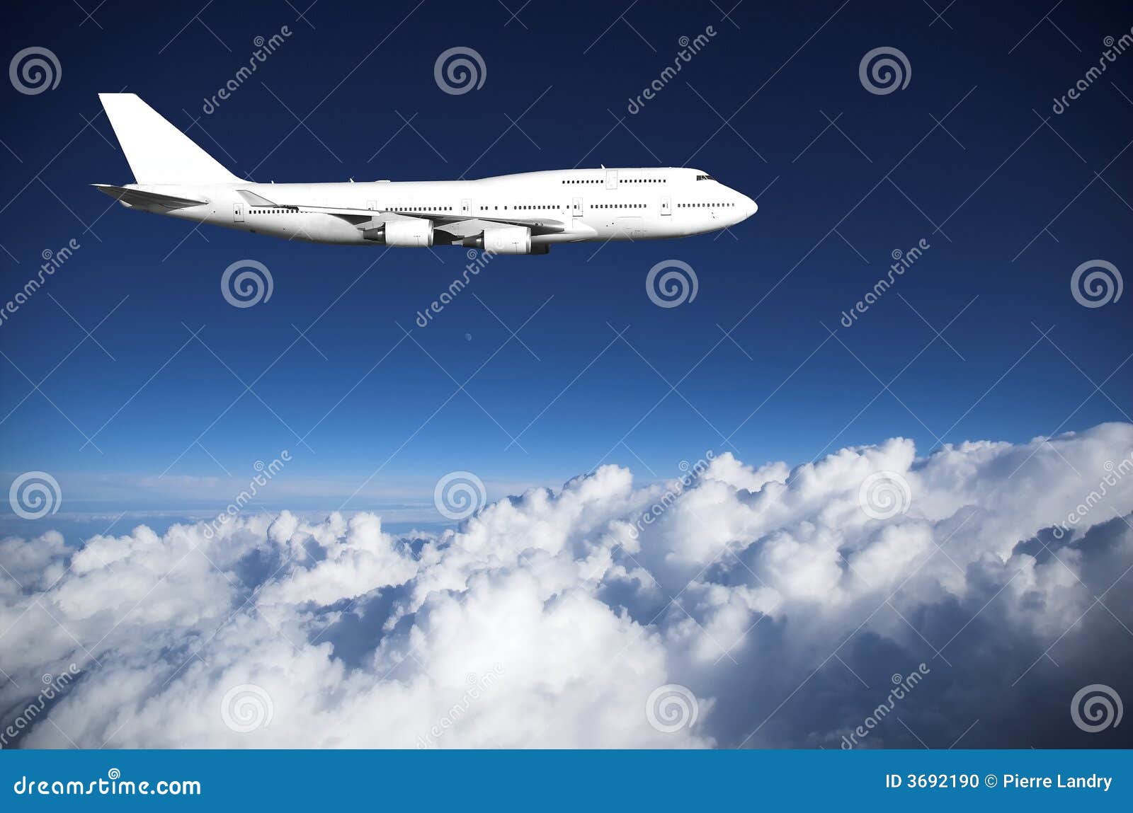 Jumbo jet above clouds stock photo. Image of flying, airliner - 3692190