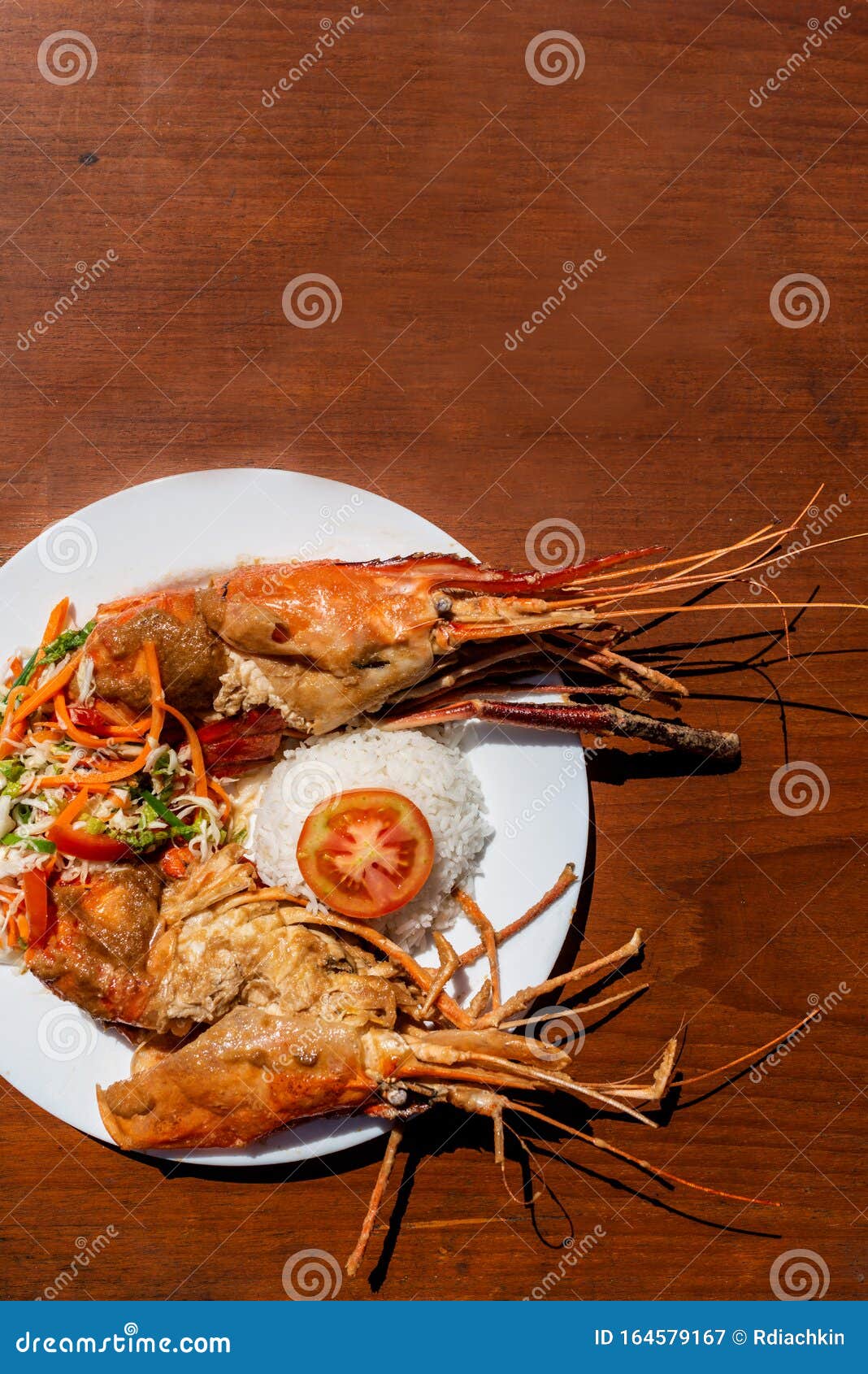 Jumbo Prawns with Side Dish and Salad on a Wooden Table. Stock Image ...