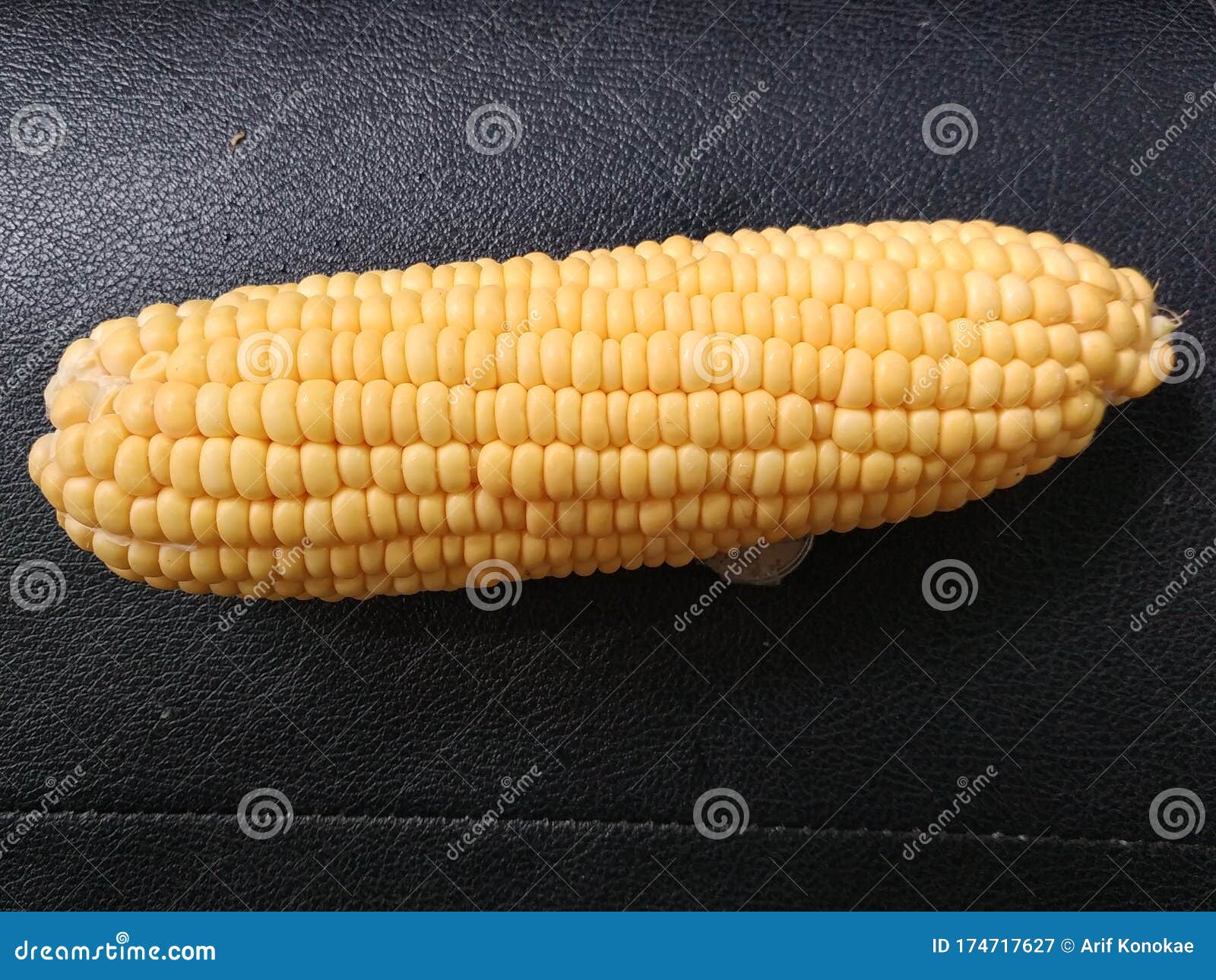 Jumbo Sized Corn on Black Leather Board Stock Image - Image of corn ...