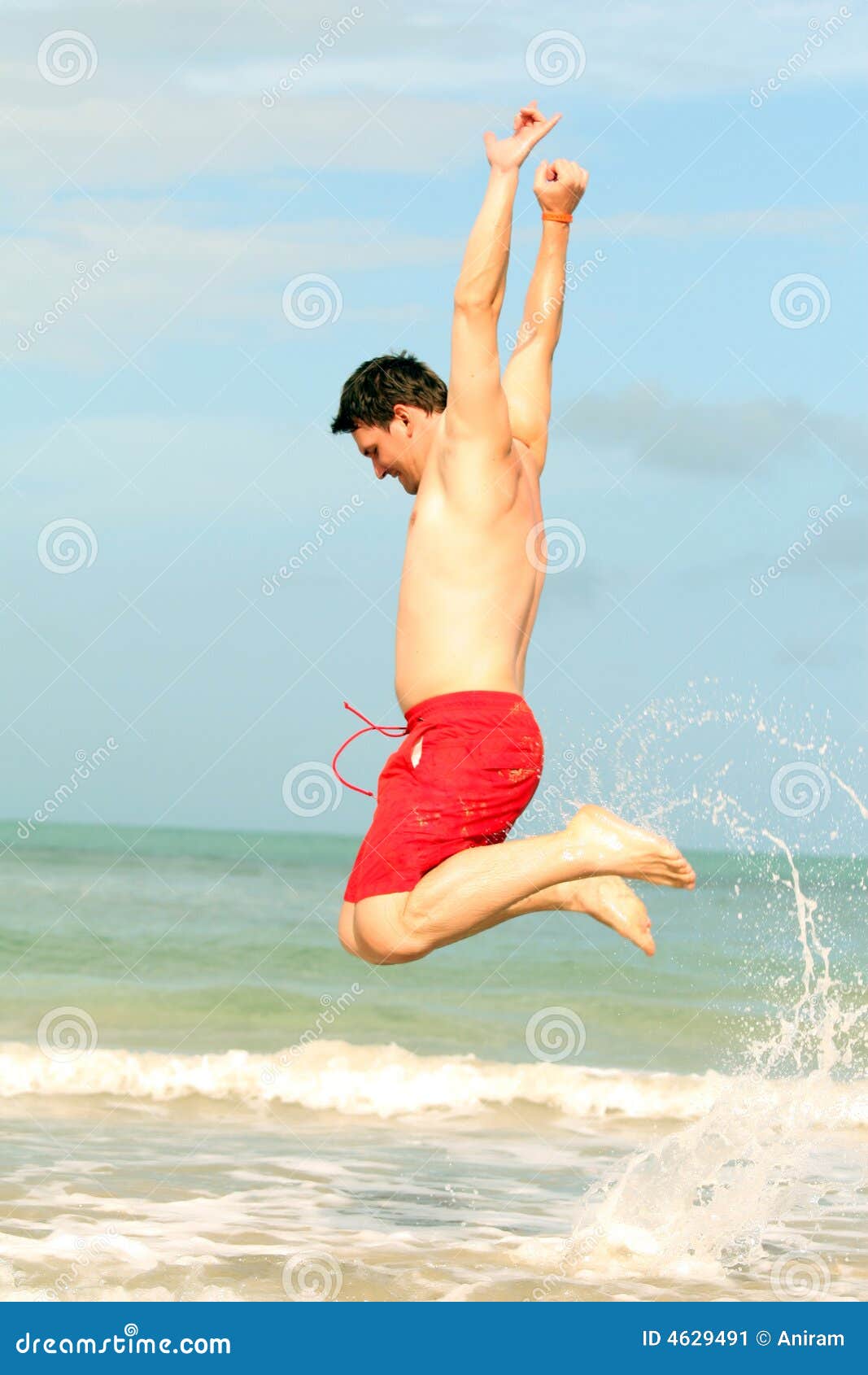 Jump on the beach stock image. Image of handsome, jump - 4629491