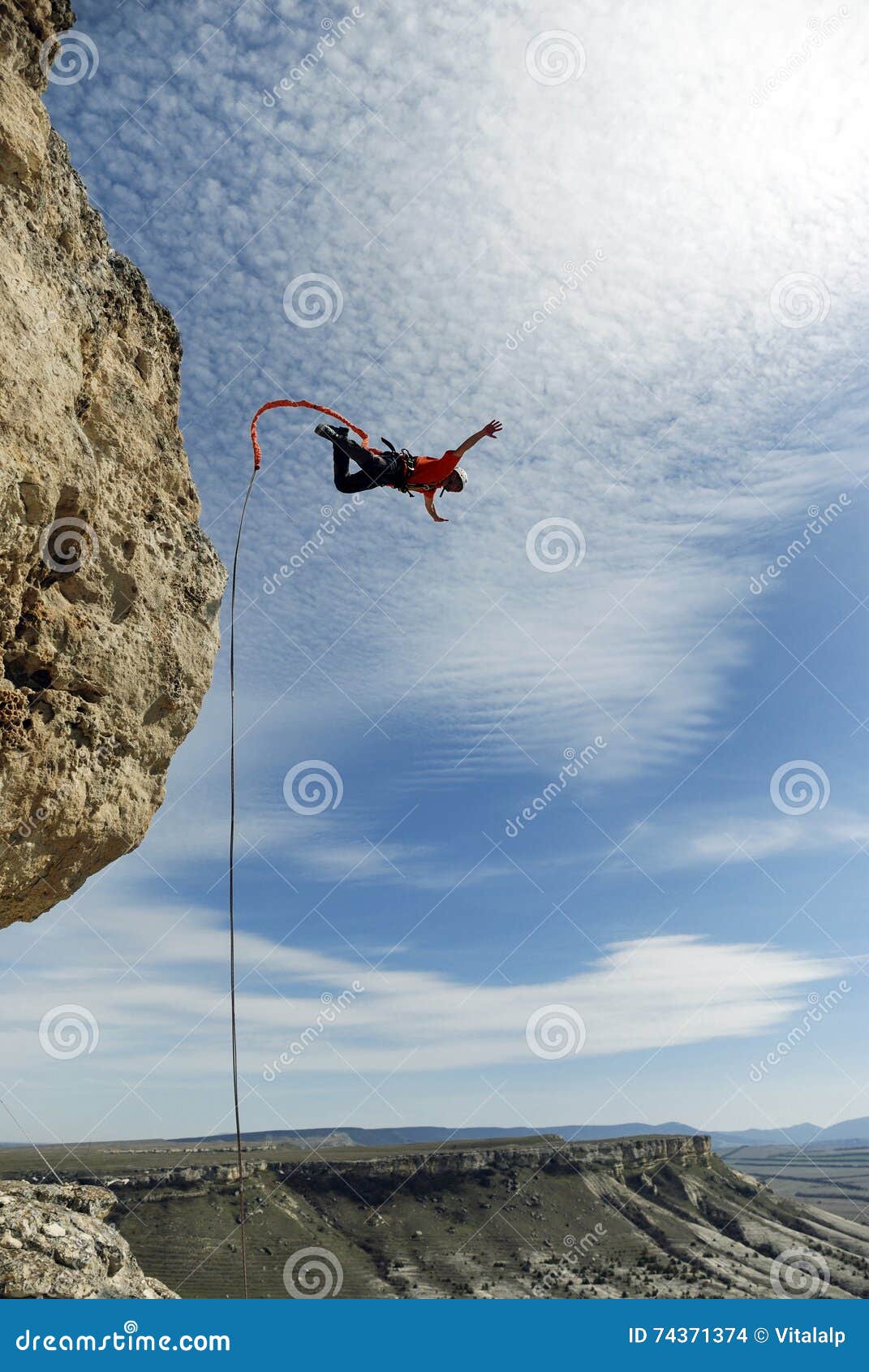 Jump off the cliff. stock photo. Image of freefall, people - 74371374