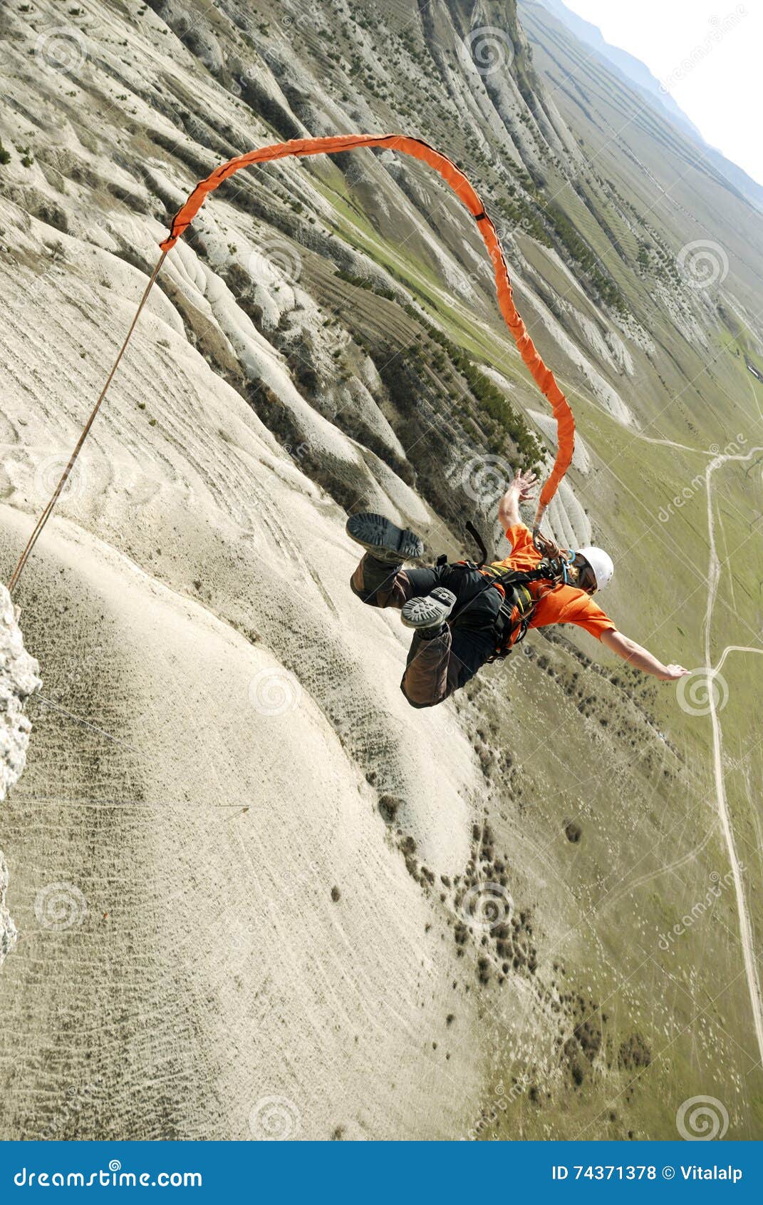 Jump off the cliff. stock photo. Image of people, color - 74371378