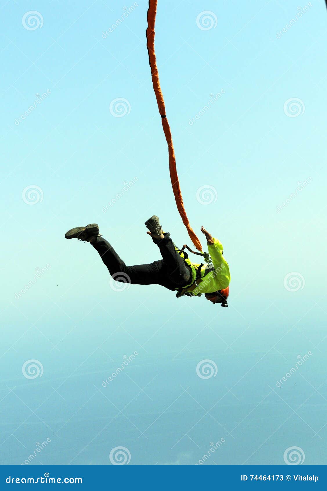 Jump off the cliff. stock image. Image of people, rope - 74464173