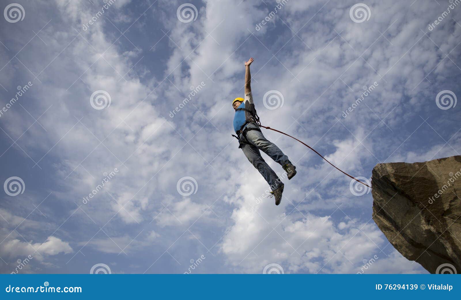 Jump off a cliff. stock image. Image of moving, adventure - 76294139