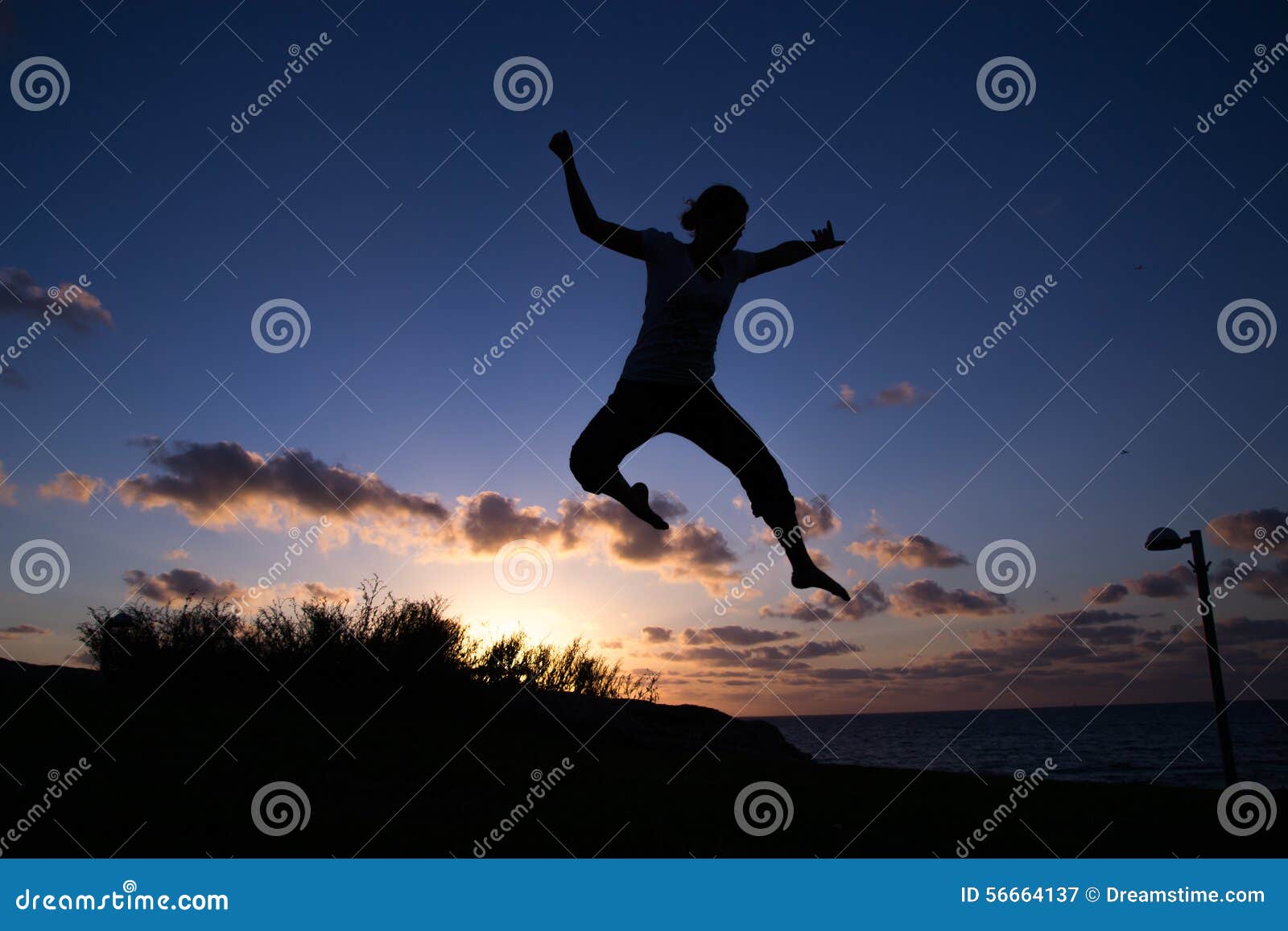 A jump at sunset stock image. Image of shadow, jaffa - 56664137