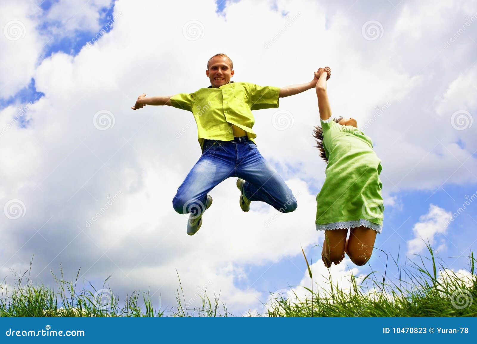 Jump of two people stock image. Image of green, blue - 10470823