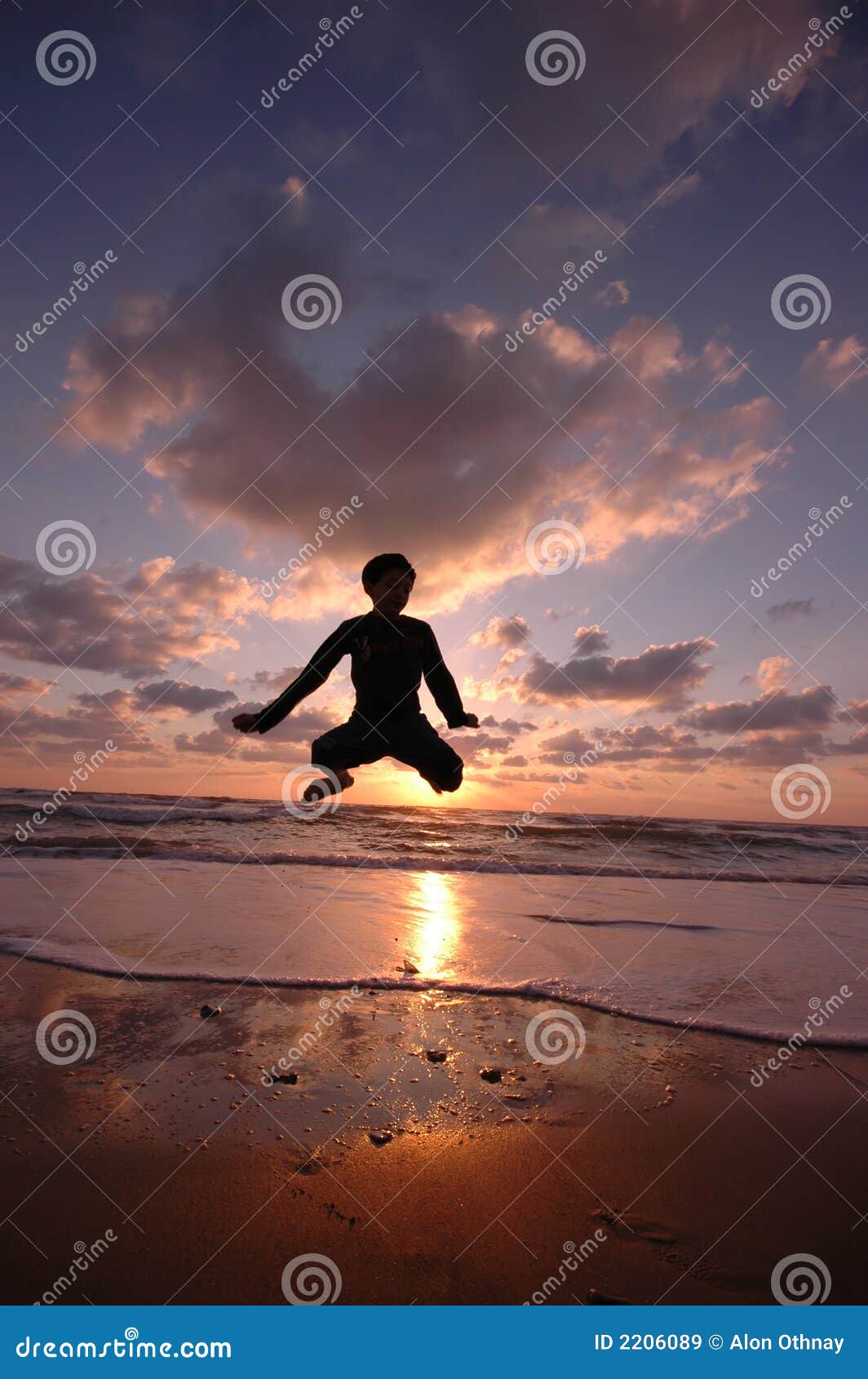 Jumping on the beach stock image. Image of beach, family - 2206089