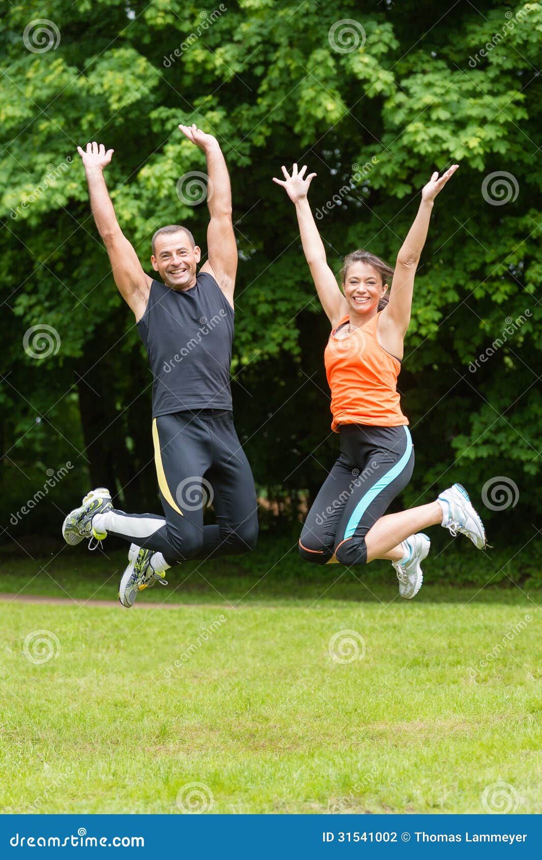 Jumping couple stock photo. Image of jogger, outdoors - 31541002