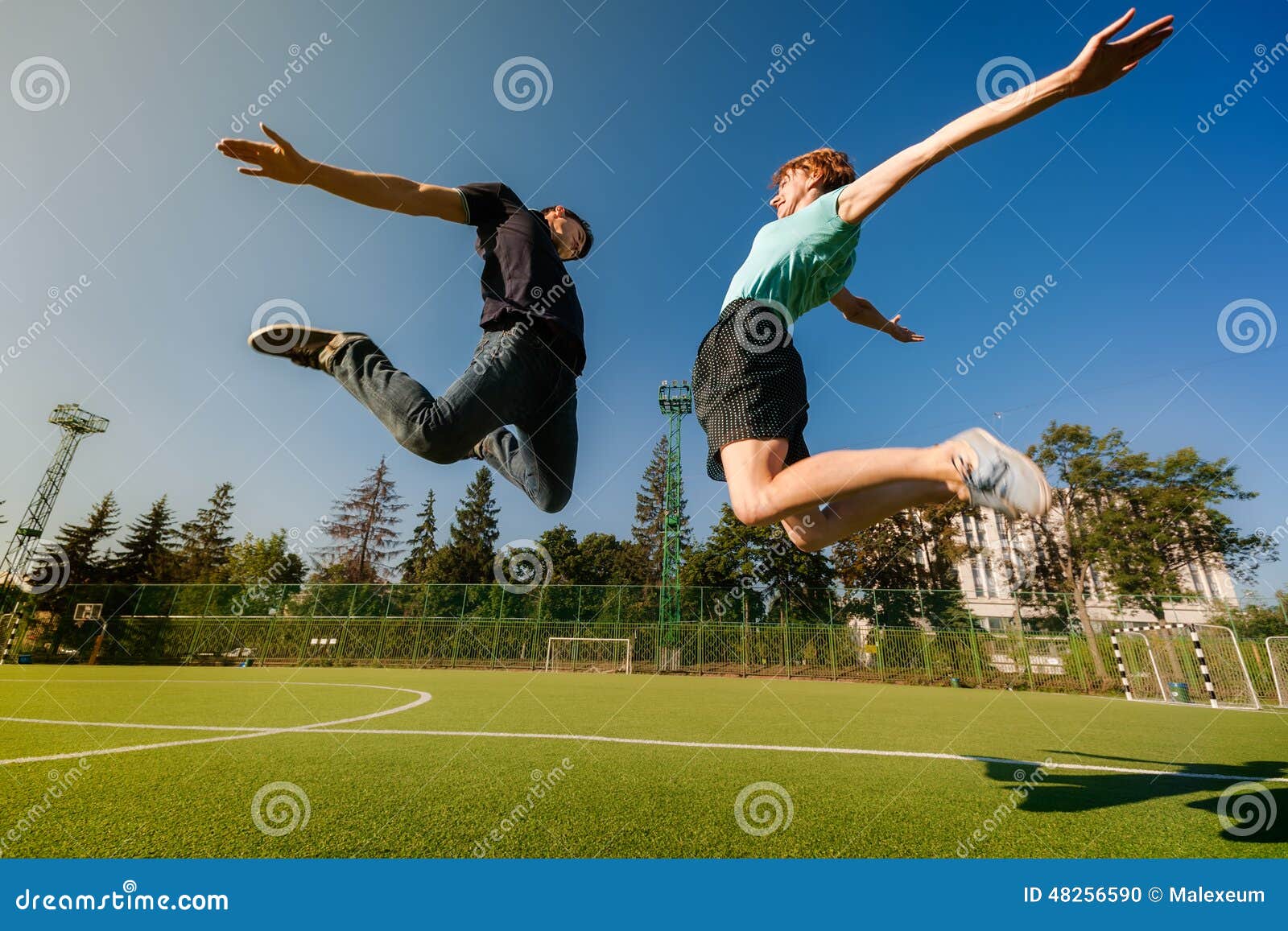 Jumping couple stock photo. Image of lifestyles, lifestyle - 48256590