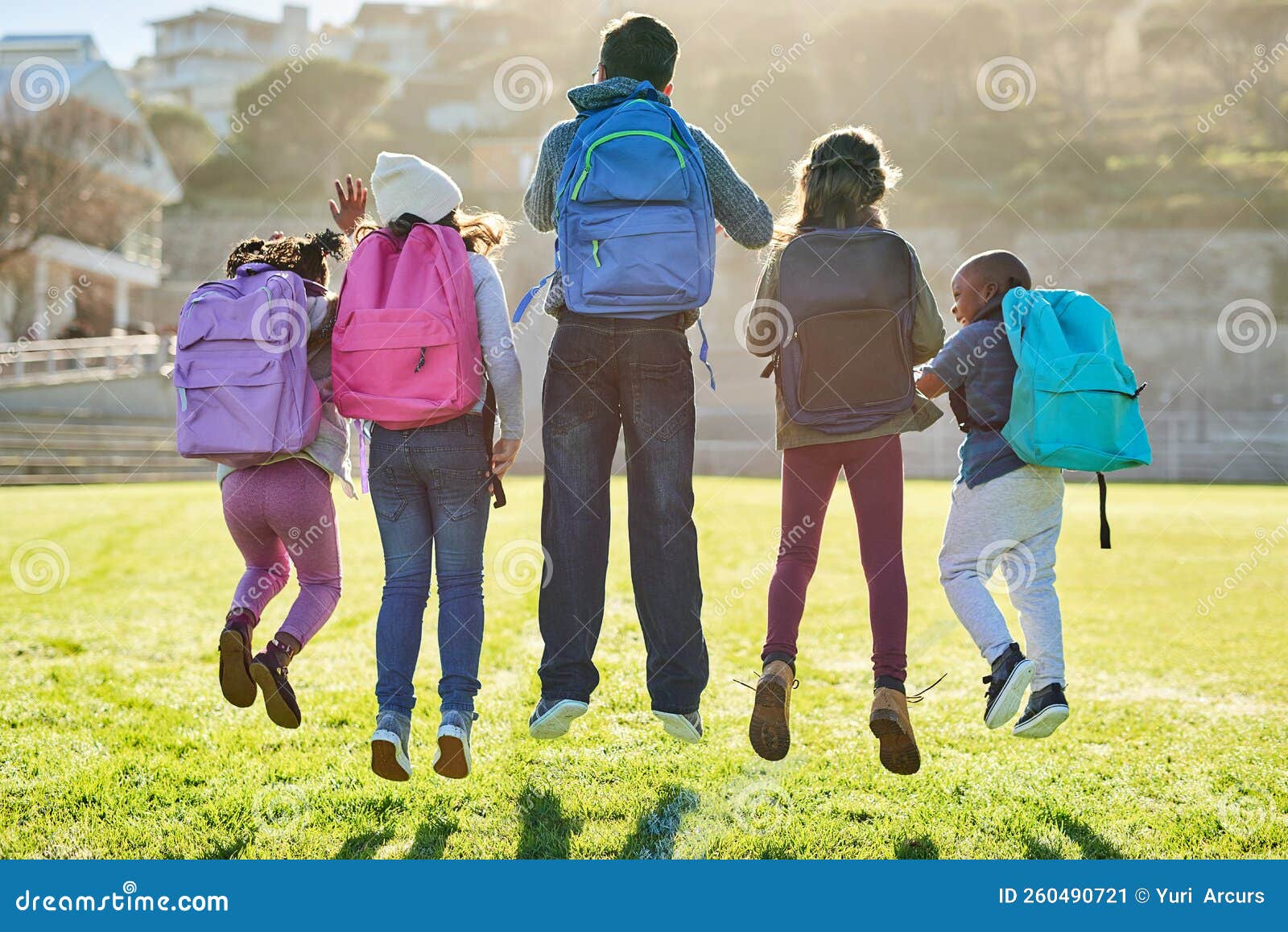 Jumping into a Day of Fun and Learning. Rearview Shot of a Group of ...