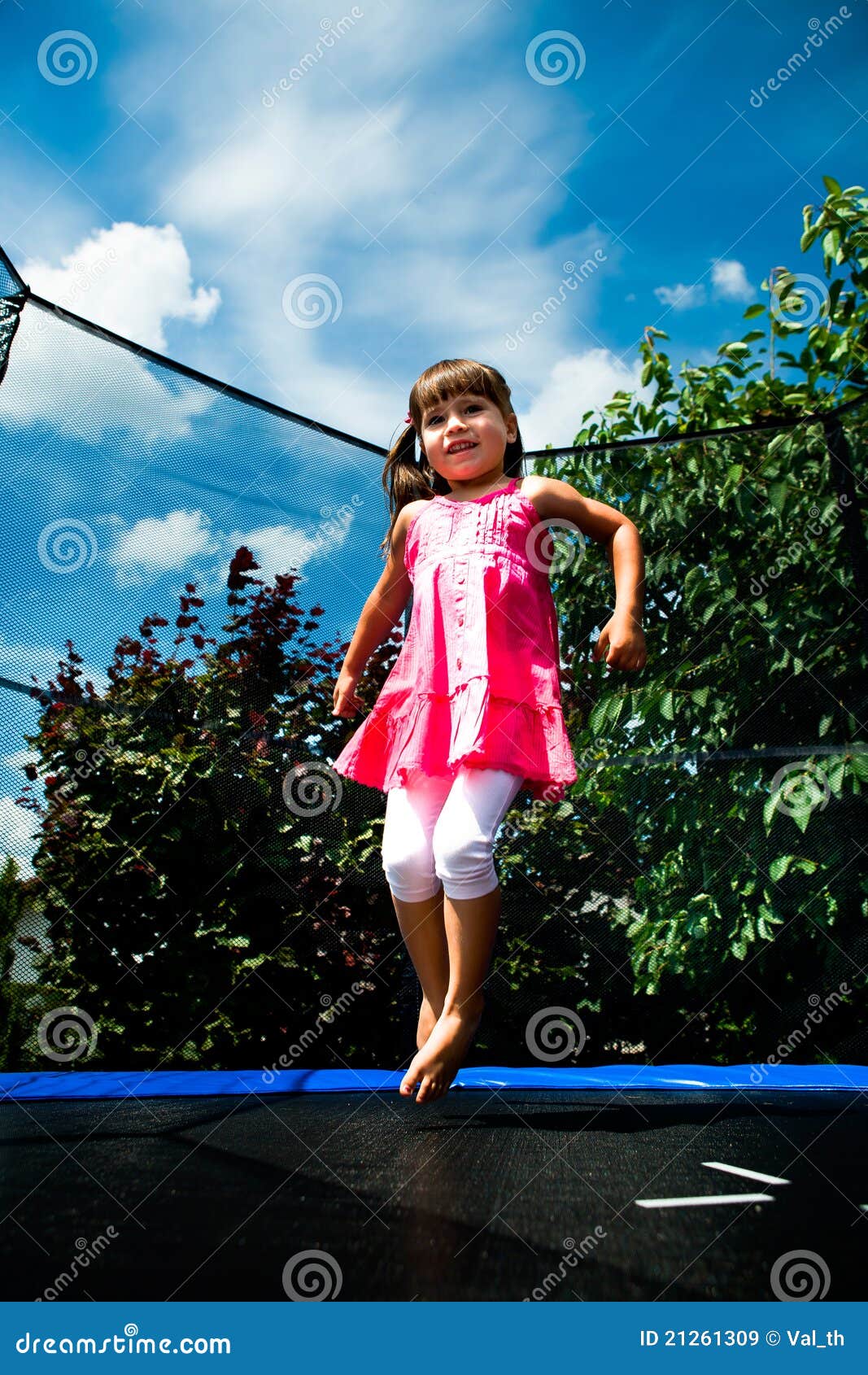 Jumping in the garden stock image. Image of play, girl - 21261309