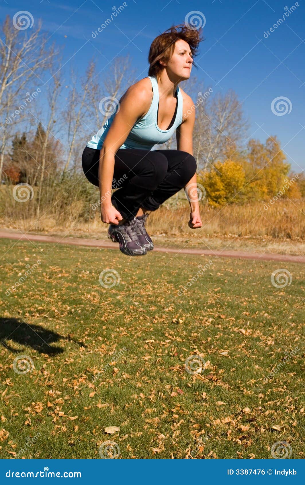 Jumping girl stock photo. Image of sports, grass, blue - 3387476