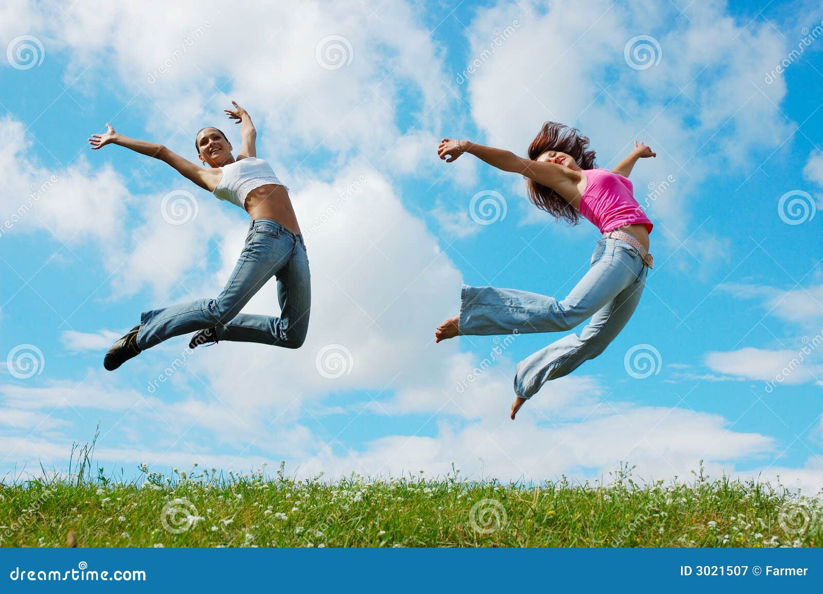 Jumping girls stock image. Image of laughing, action, jeans - 3021507