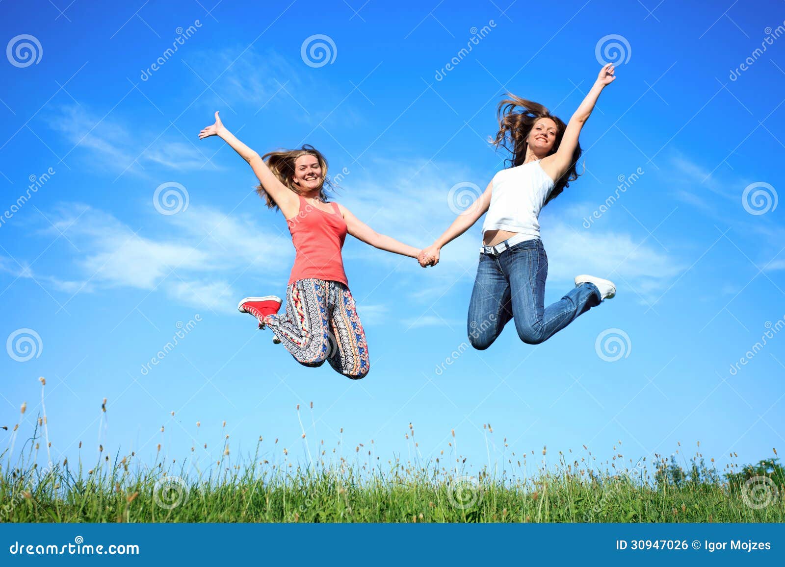 Jumping girls stock photo. Image of happy, friendship - 30947026
