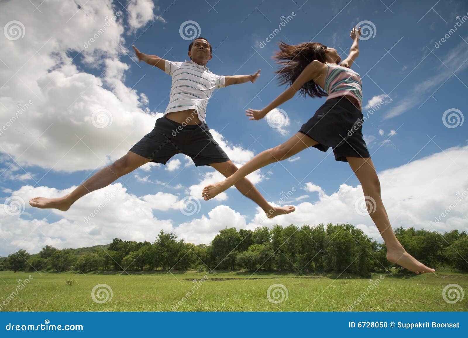 Jumping in the grass stock photo. Image of recreation - 6728050