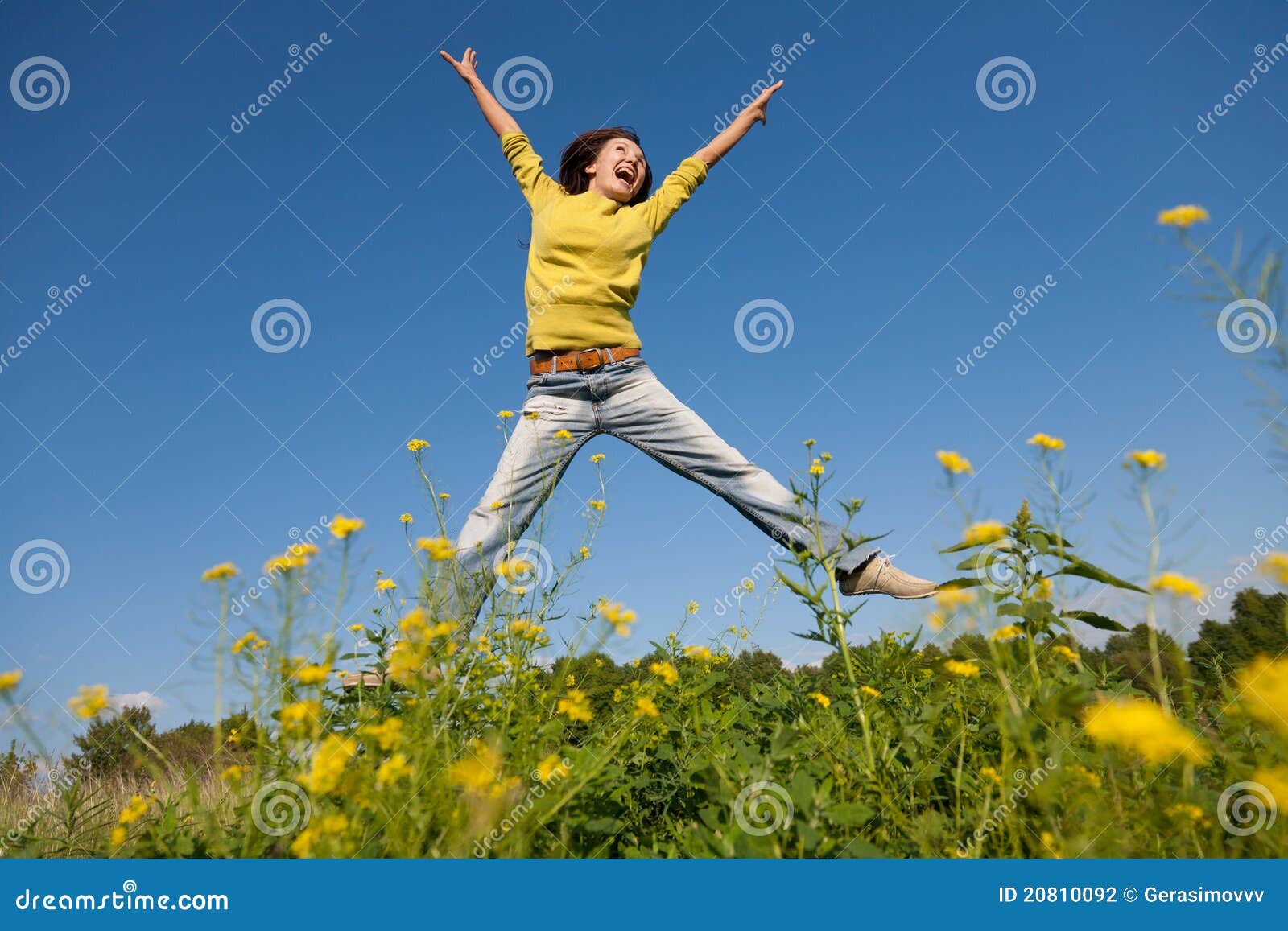 Jumping happy girl stock photo. Image of blue, legs, grass - 20810092