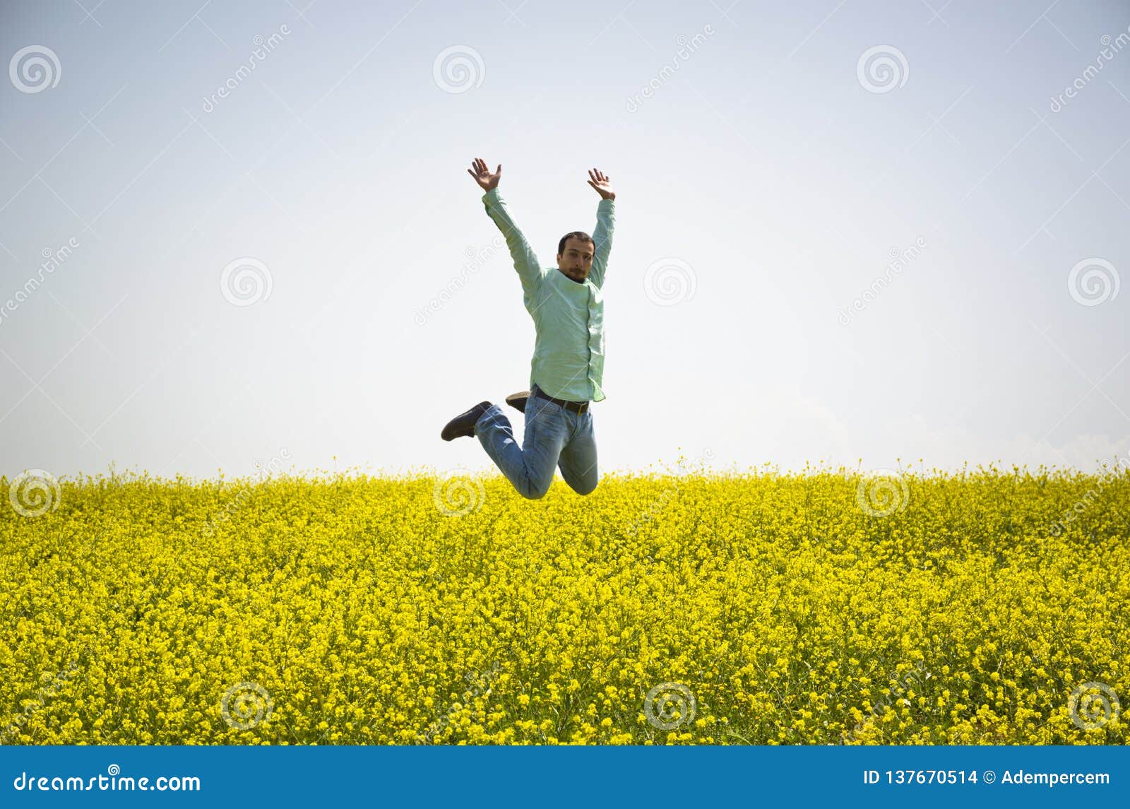 Jumping Happy Young Man stock photo. Image of adult - 137670514