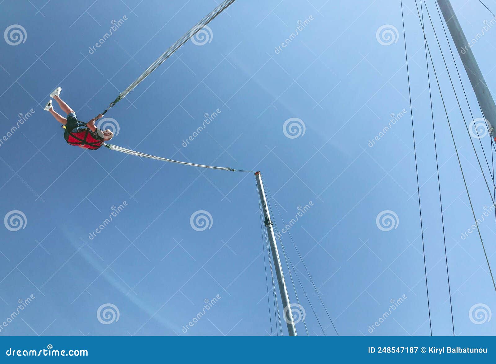 Jumping on a High Mountain. Rope Jumping, Trampoline on the Edge of the ...