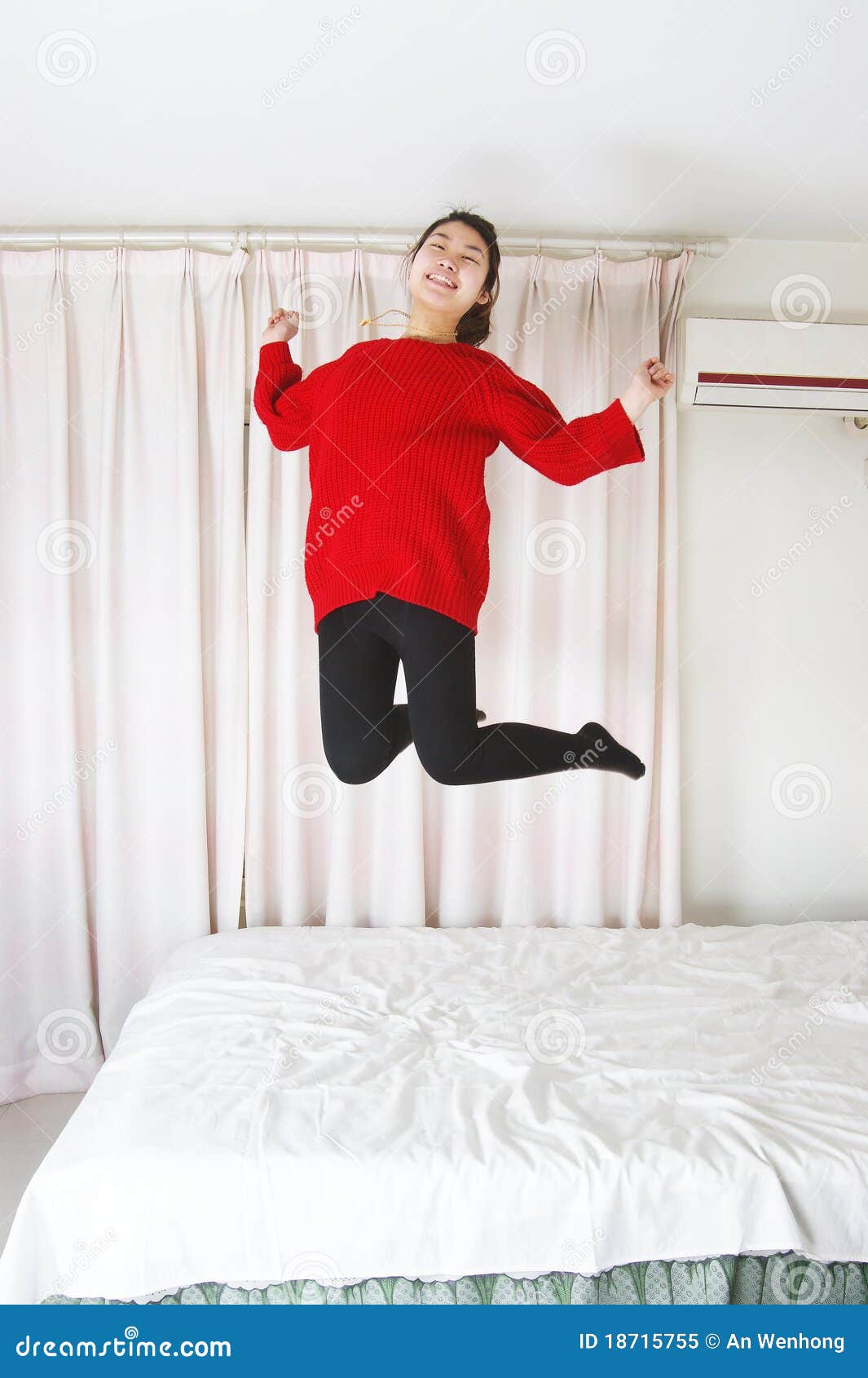 Jumping on the indoor stock image. Image of jeans, happy - 18715755