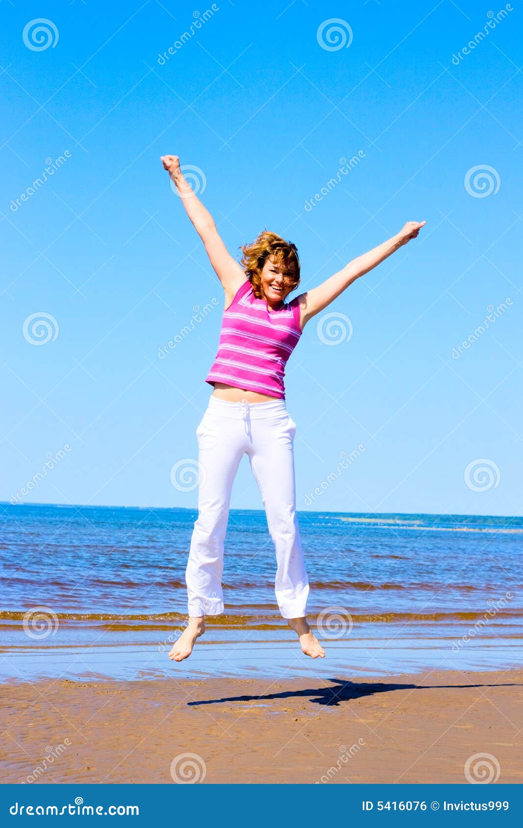 Jumping in joy stock photo. Image of coast, jump, outdoor - 5416076