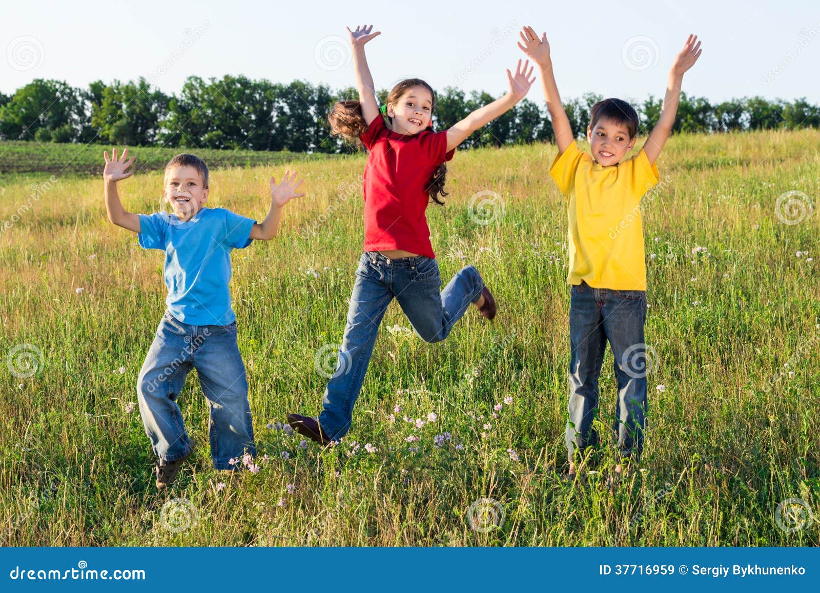 Jumping Kids on Green Field Stock Image - Image of movement, lawn: 37716959