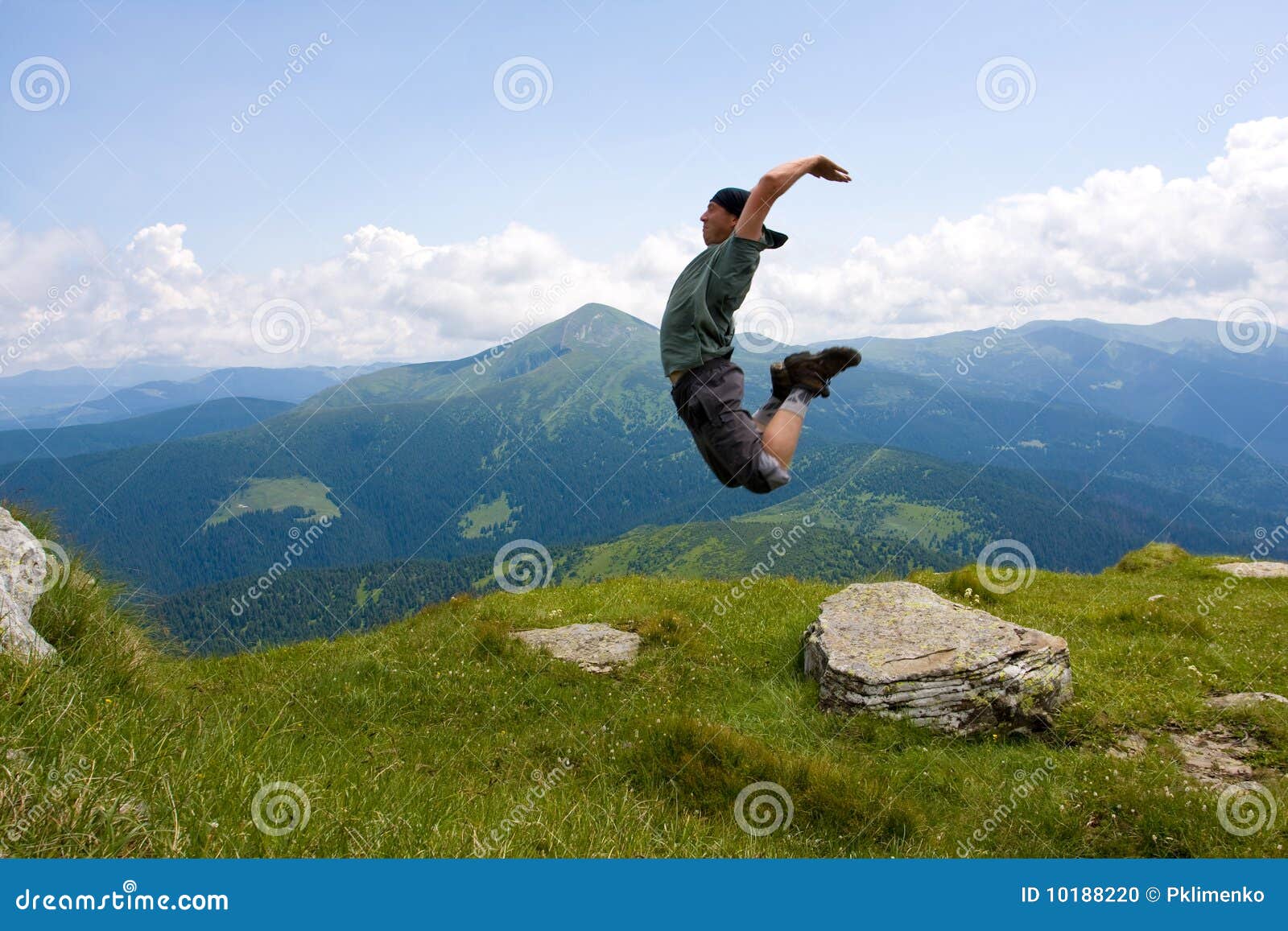 Jumping man in mountains stock photo. Image of active - 10188220