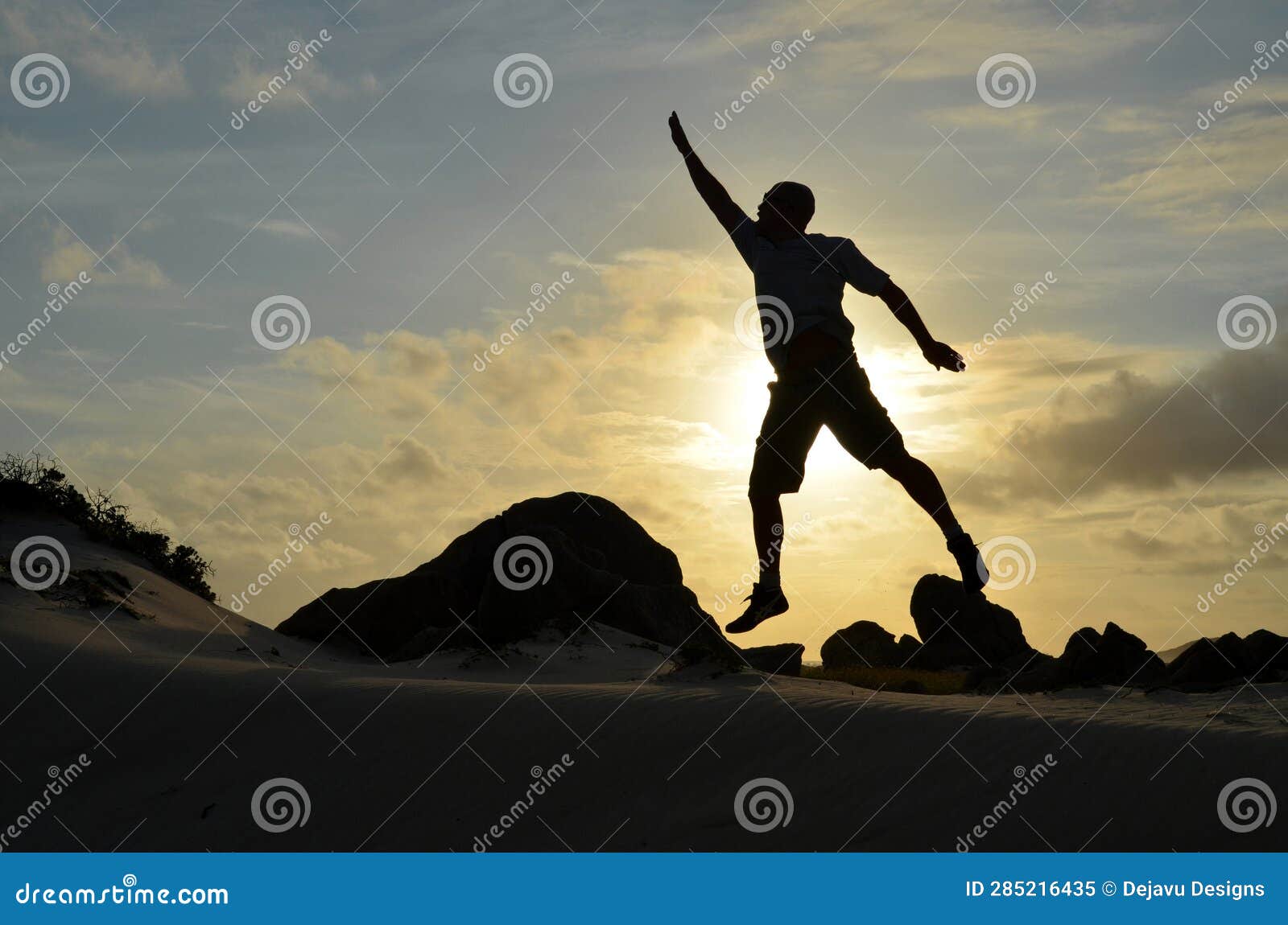 Jumping Man Reaching for the Stars at Sunrise Stock Image - Image of ...