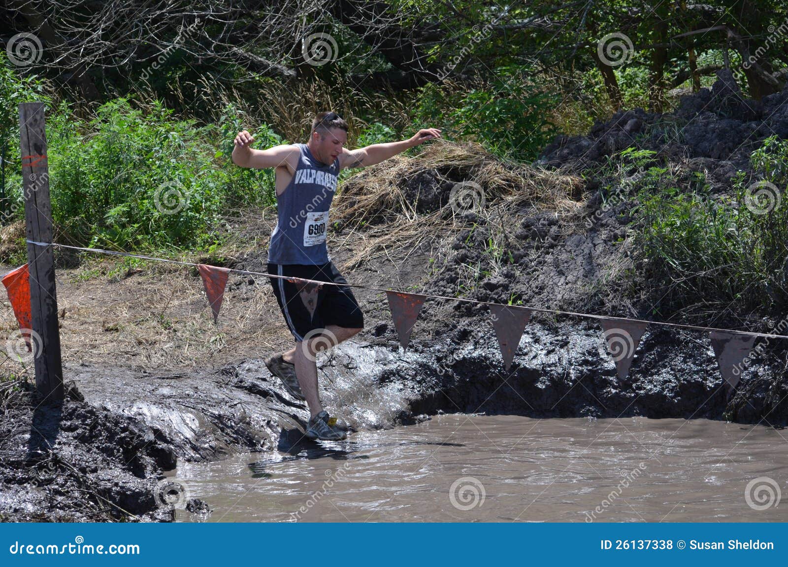 Jumping into mud editorial stock photo. Image of sport - 26137338