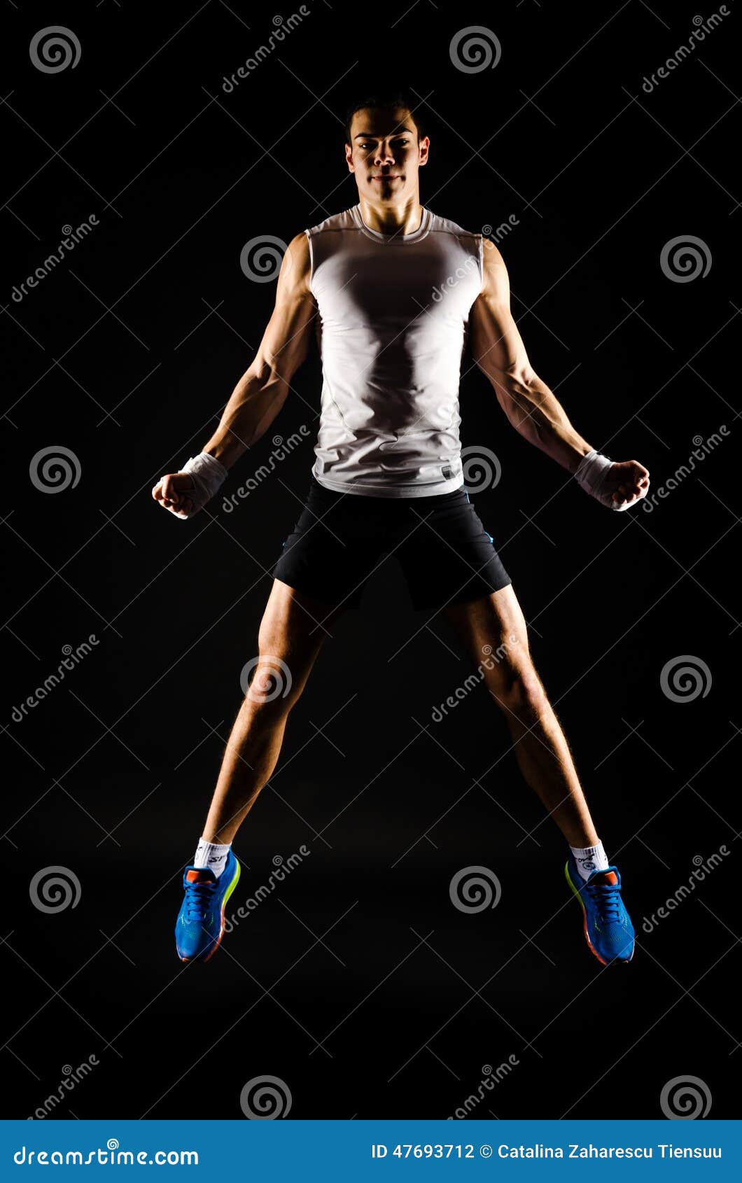 Jumping muscular man stock photo. Image of muscular, blue - 47693712