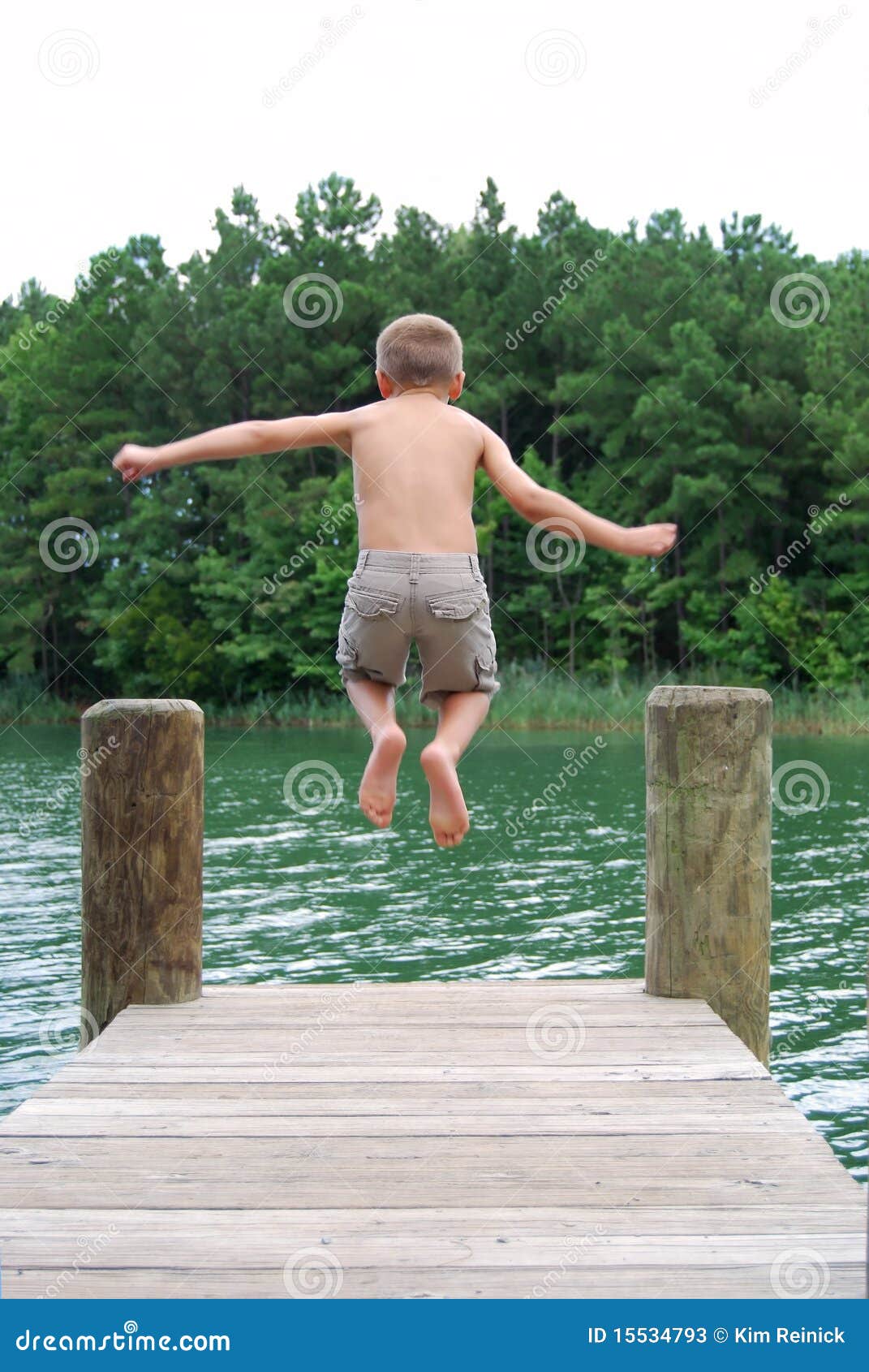 Jumping Off stock image. Image of playful, pier, lake - 15534793