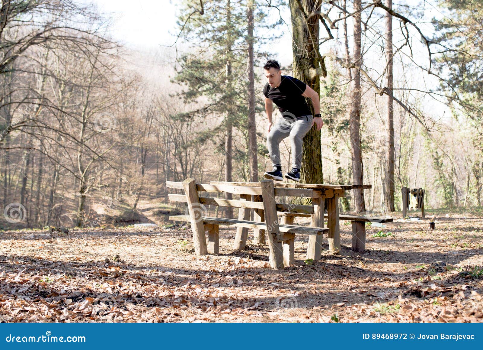 Jumping over the bench stock photo. Image of forest, athlete - 89468972