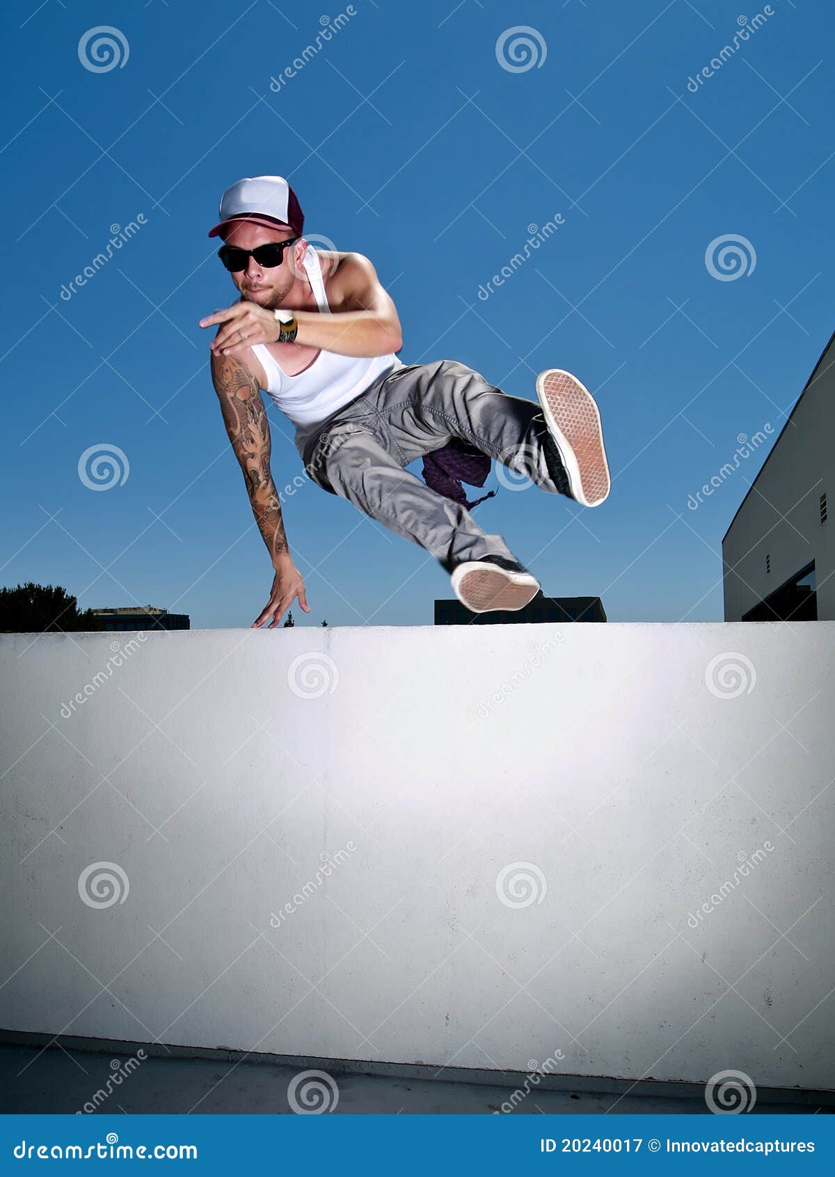 Jumping over a wall stock image. Image of dangerous, freerunning - 20240017