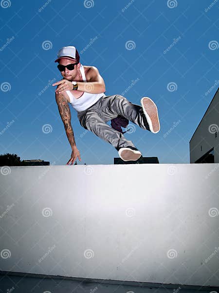 Jumping over a wall stock image. Image of parkour, freerunner - 20240017